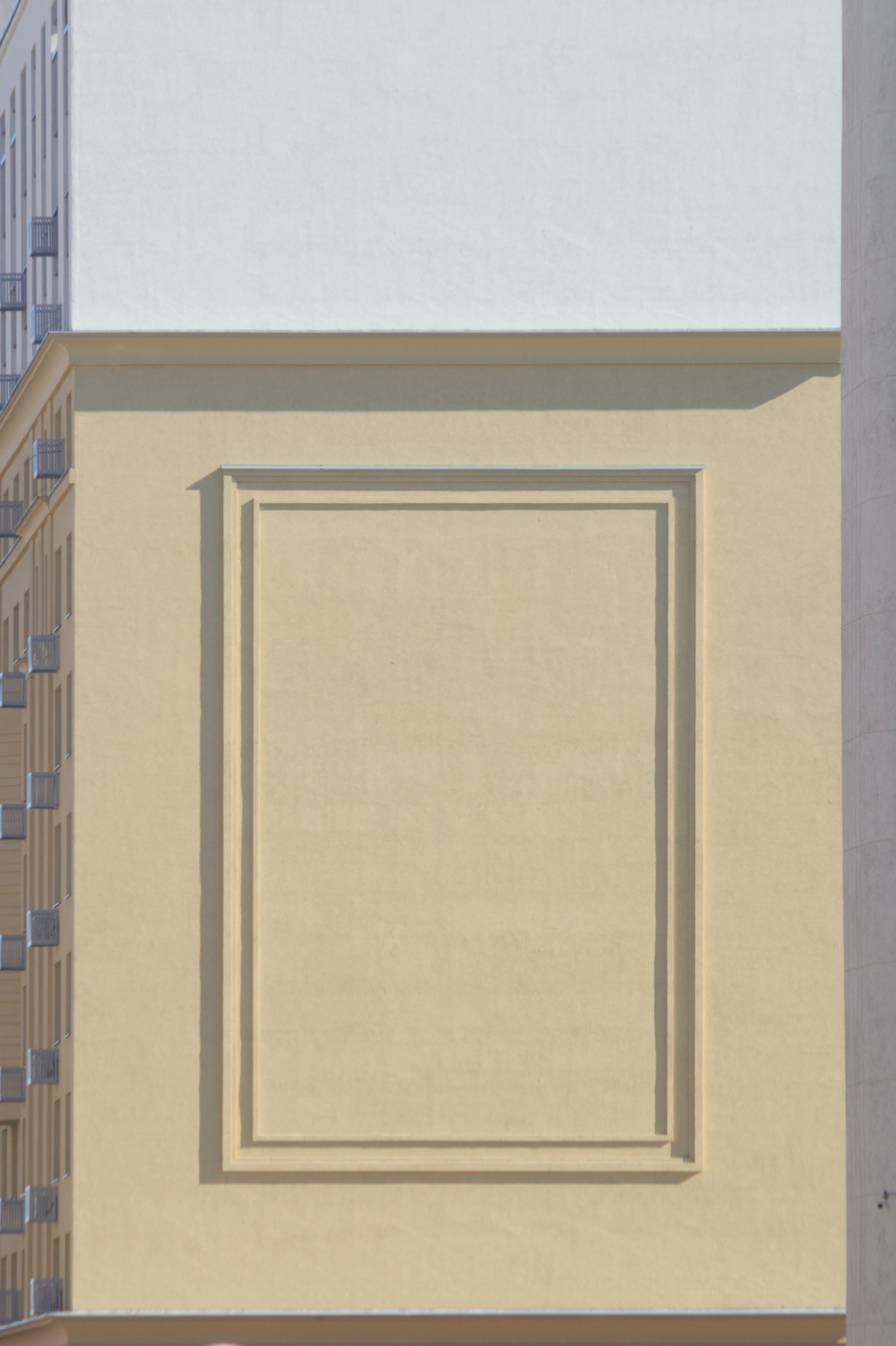 Minimalist Facade: The Quiet Relief of a Framed Wall Panel