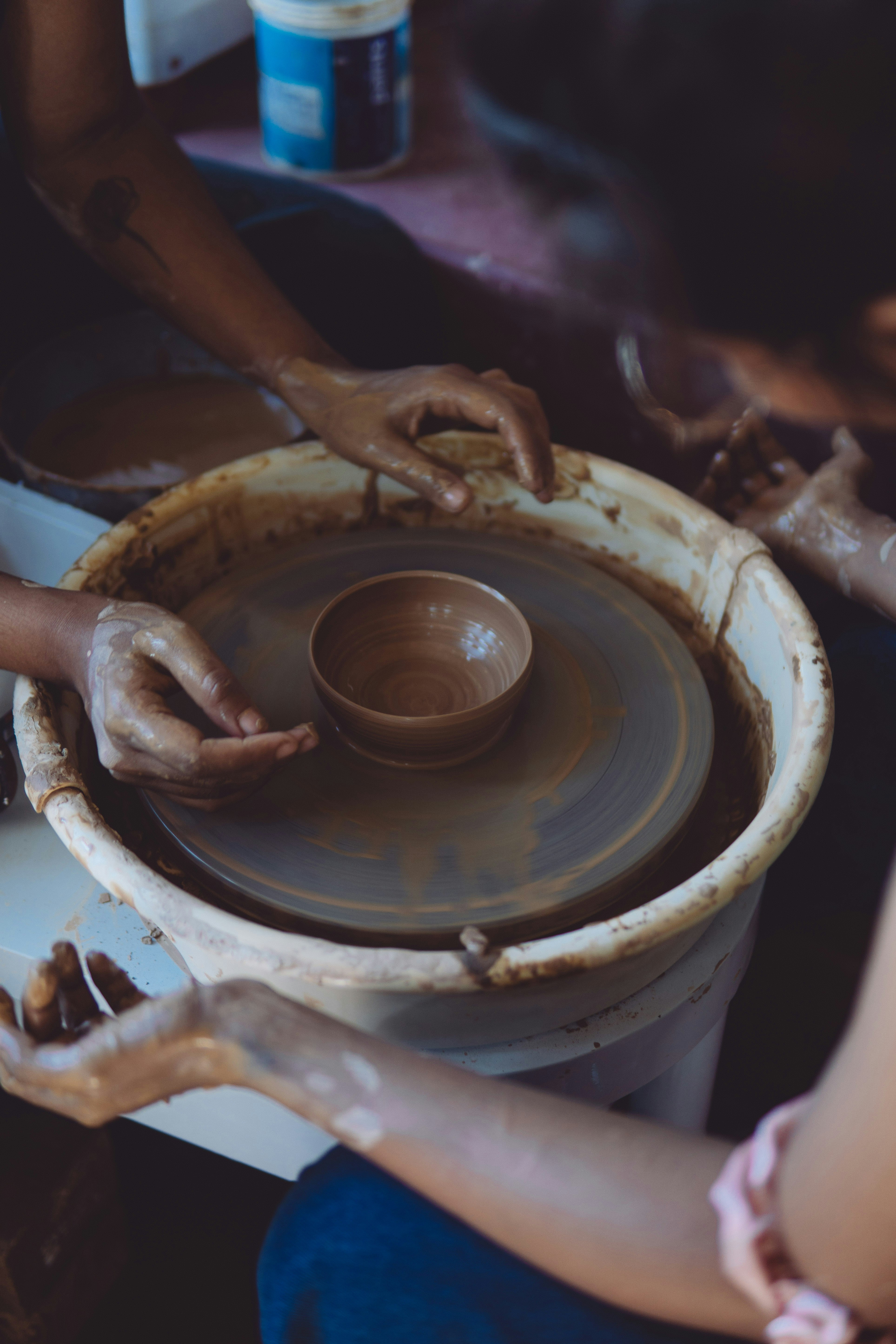 Hands at the Wheel of Clay: A Pottery Moment on the Wheel