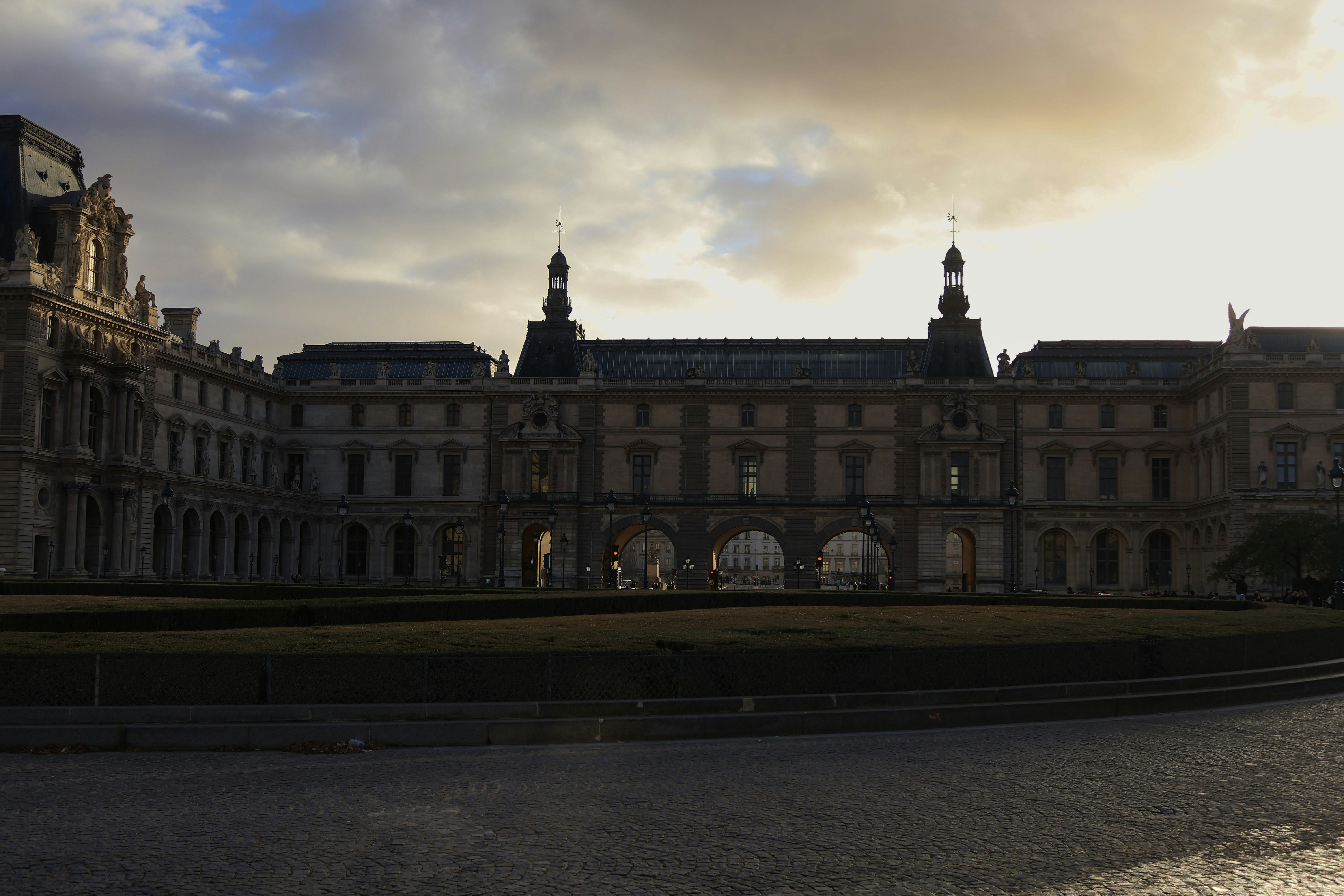 Arcaded Courtyard under a Sunset Skyline