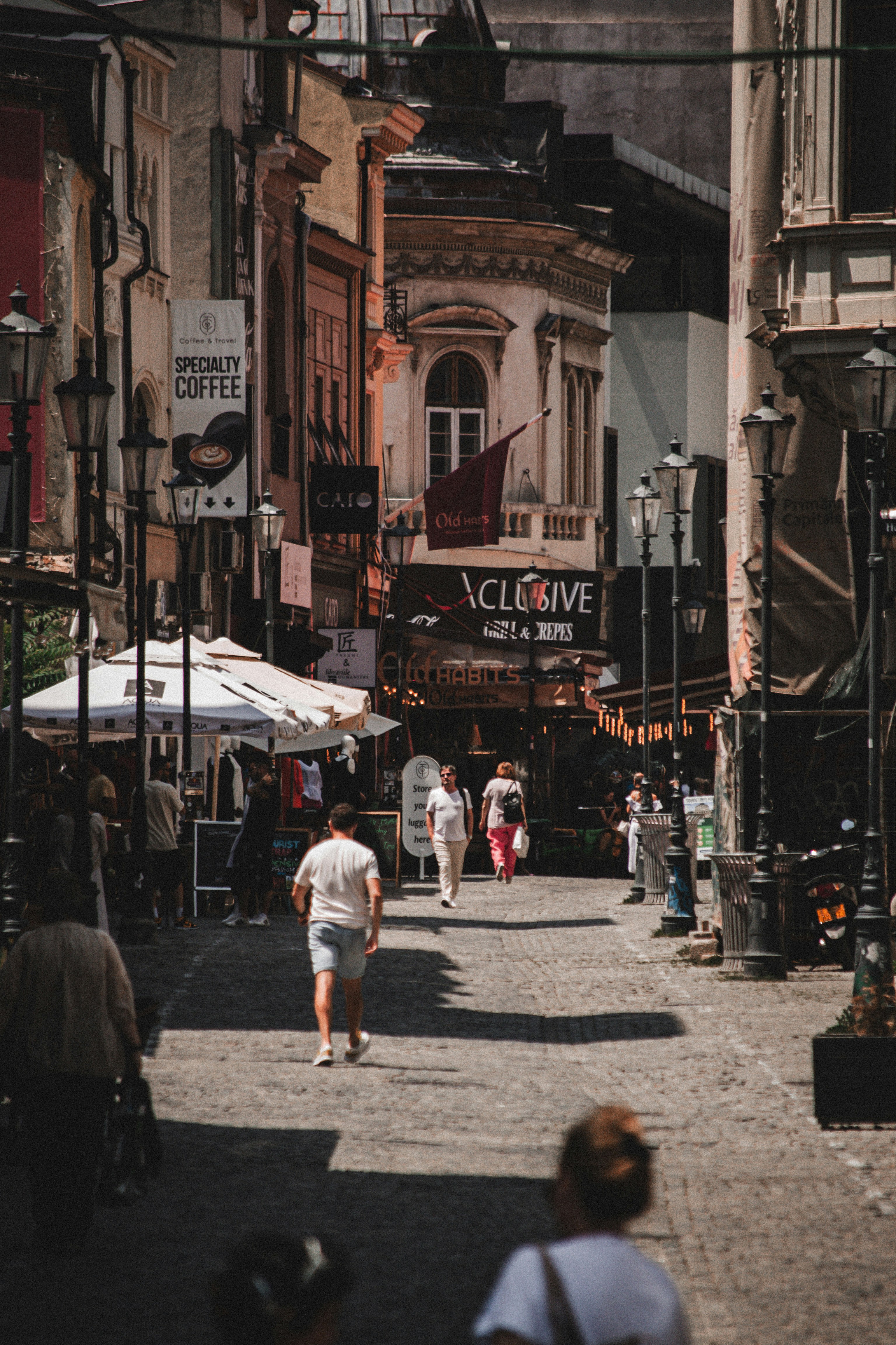 Cobbled Lane Echoes: Quiet Sunlight on a Bustling Street