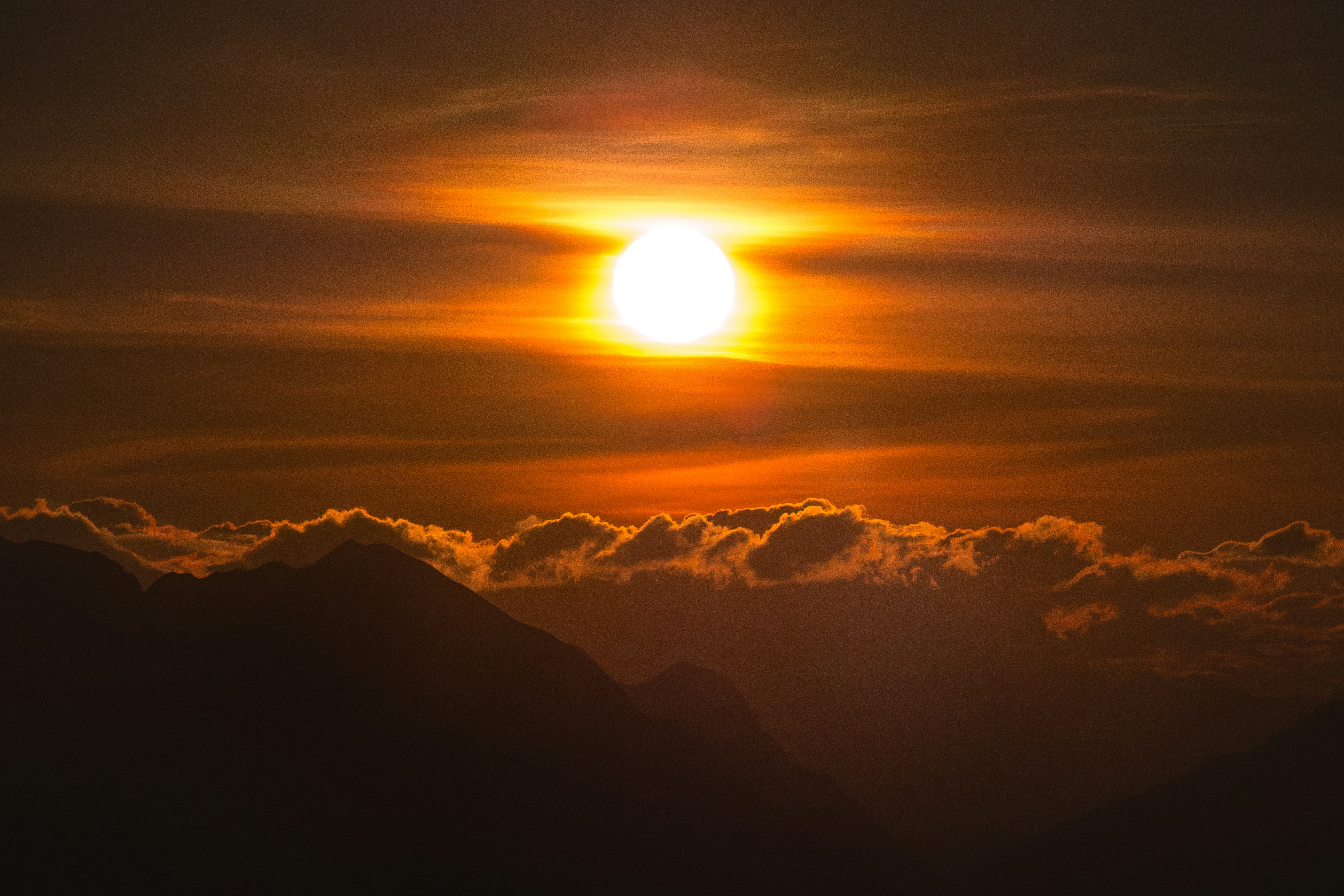 Sunlit Peak Over a Sea of Clouds
