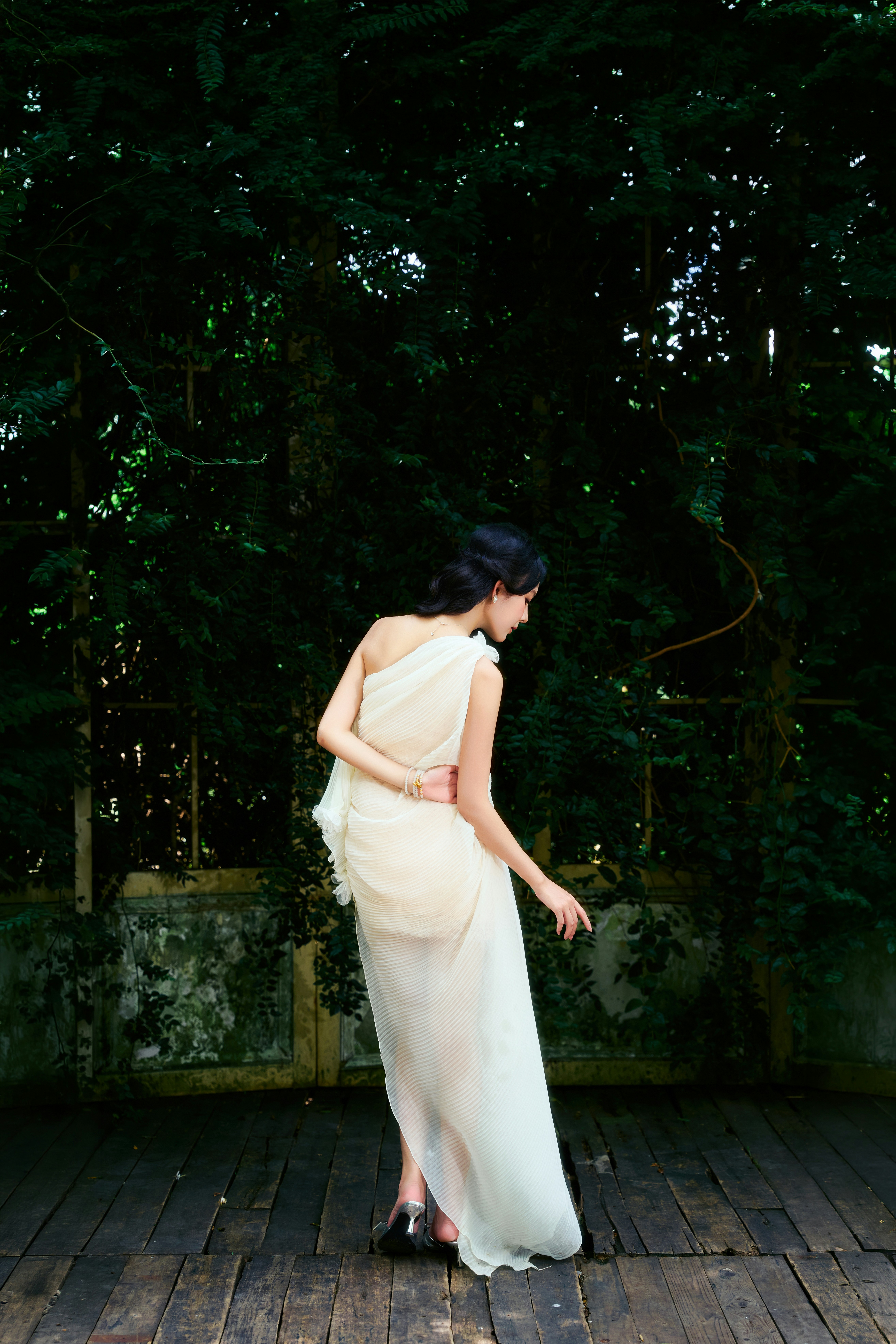 Graceful Exit: A Drape of Light on a White Silk Gown
