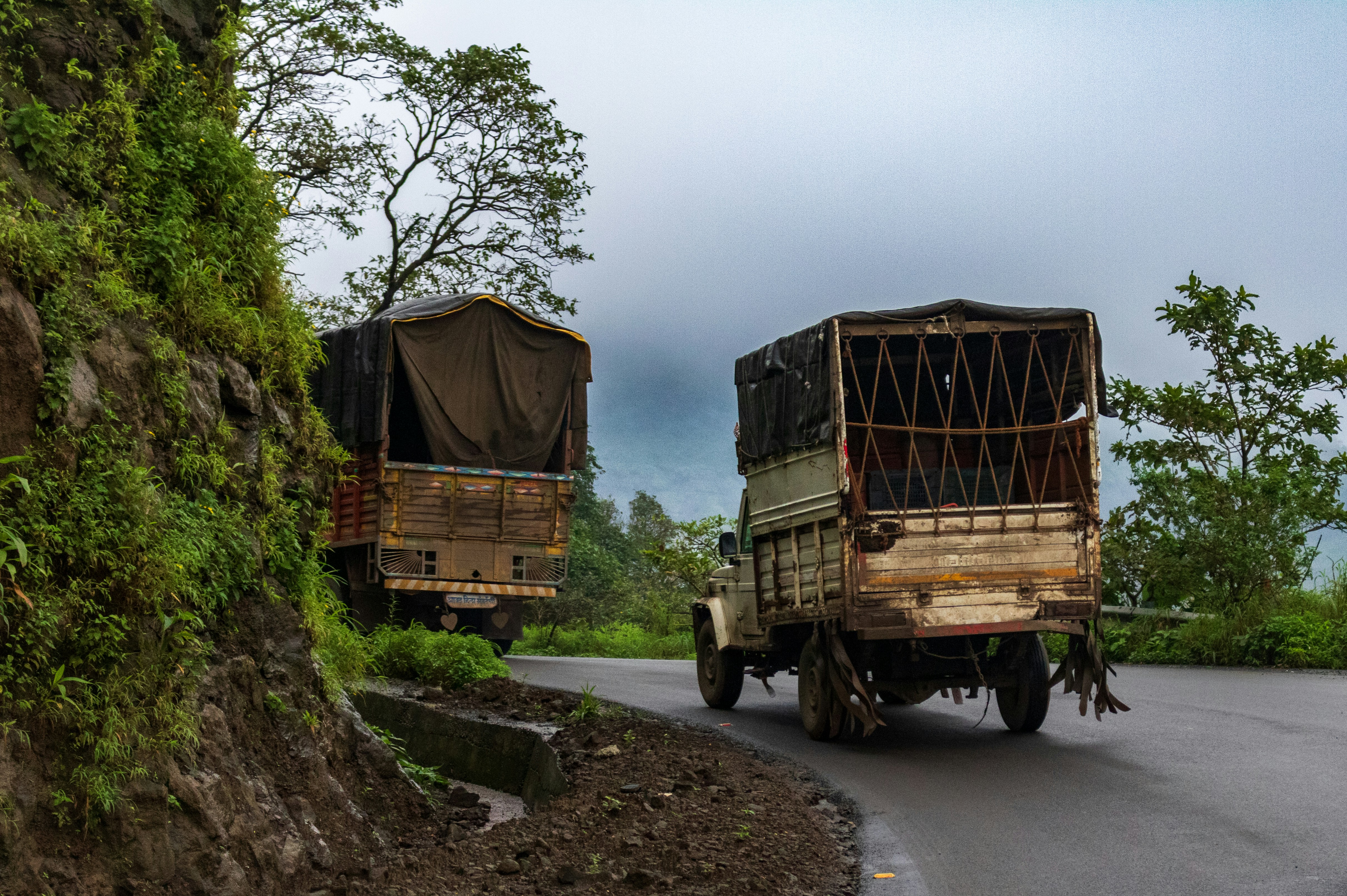 Tow-Homeward Journey: Dual Trucks on a Winding Mountain Road