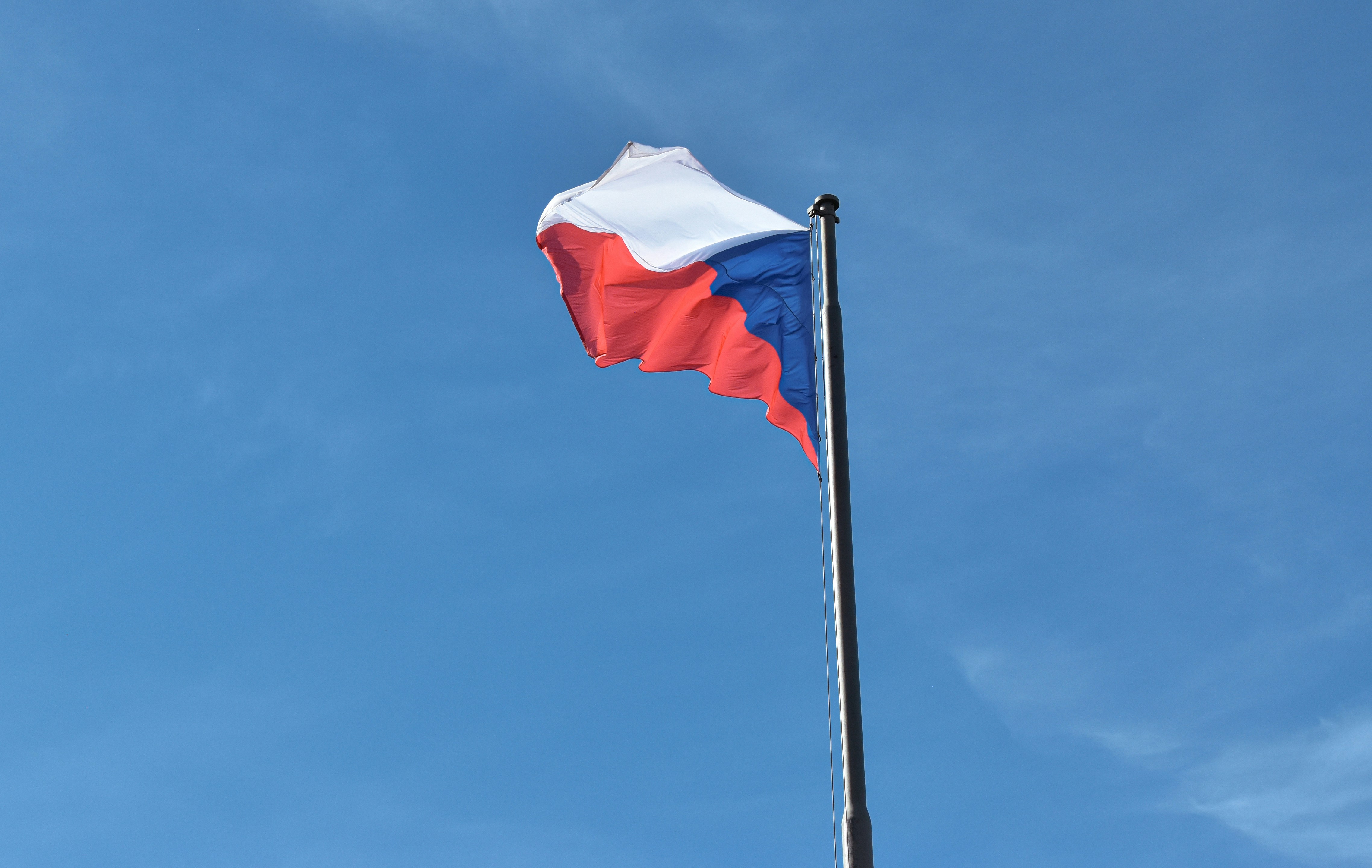 Flag on a Pole Beneath a Clear Sky