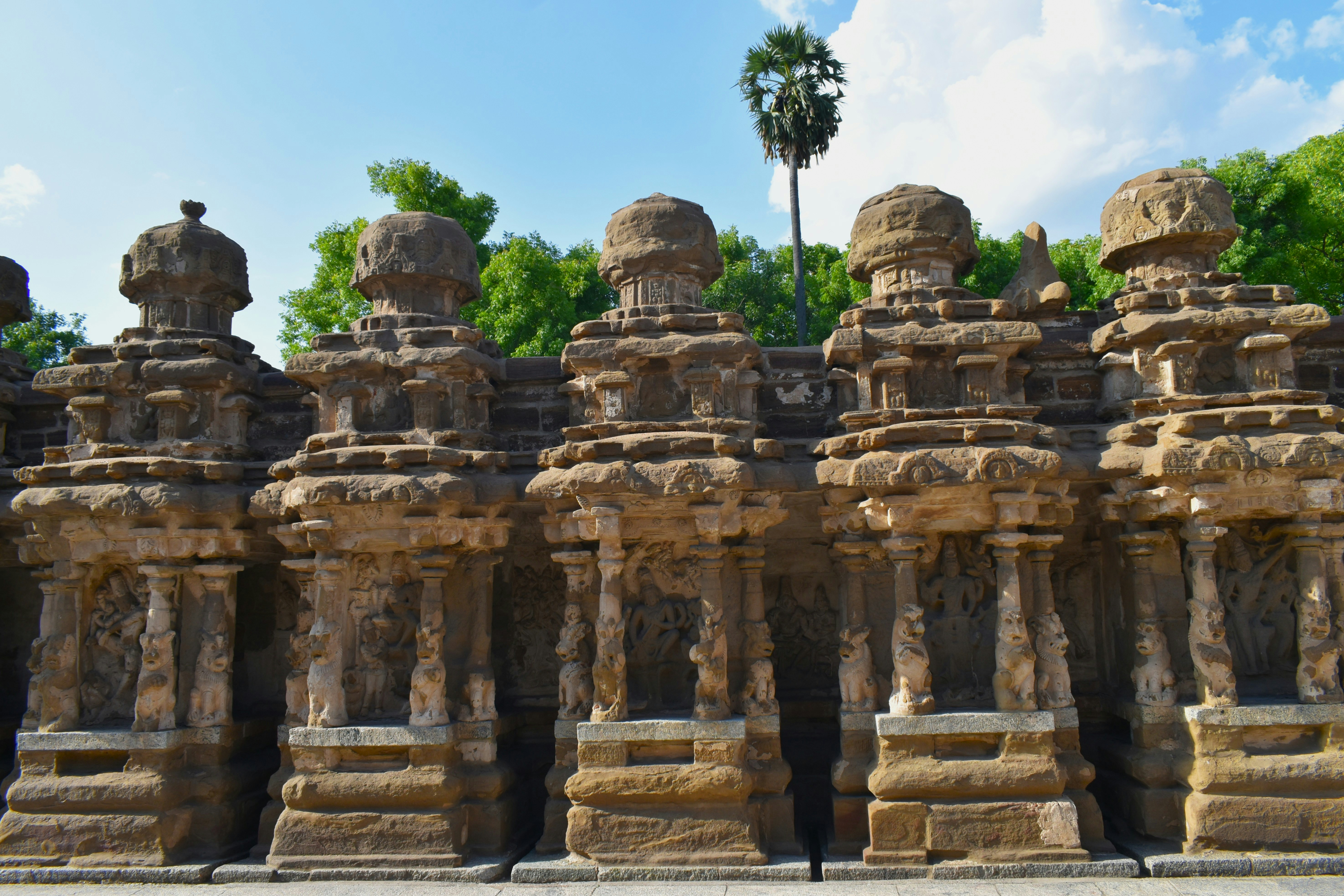 Stone Guardian Row: Ancient Carved Towers Standing in Solid Silence