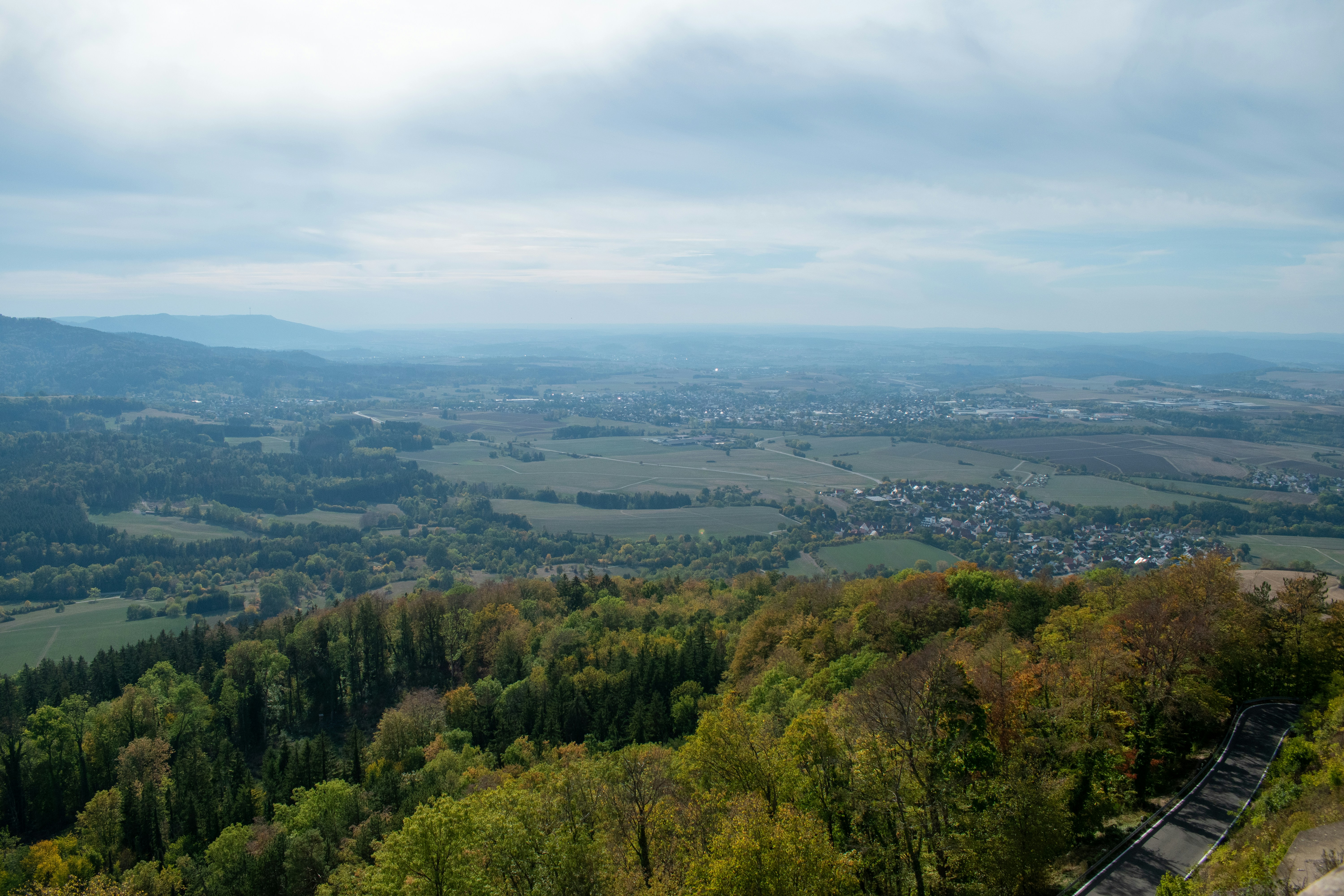 Ridgetop Panorama: A Quiet Valley Unfolds under Layered Clouds