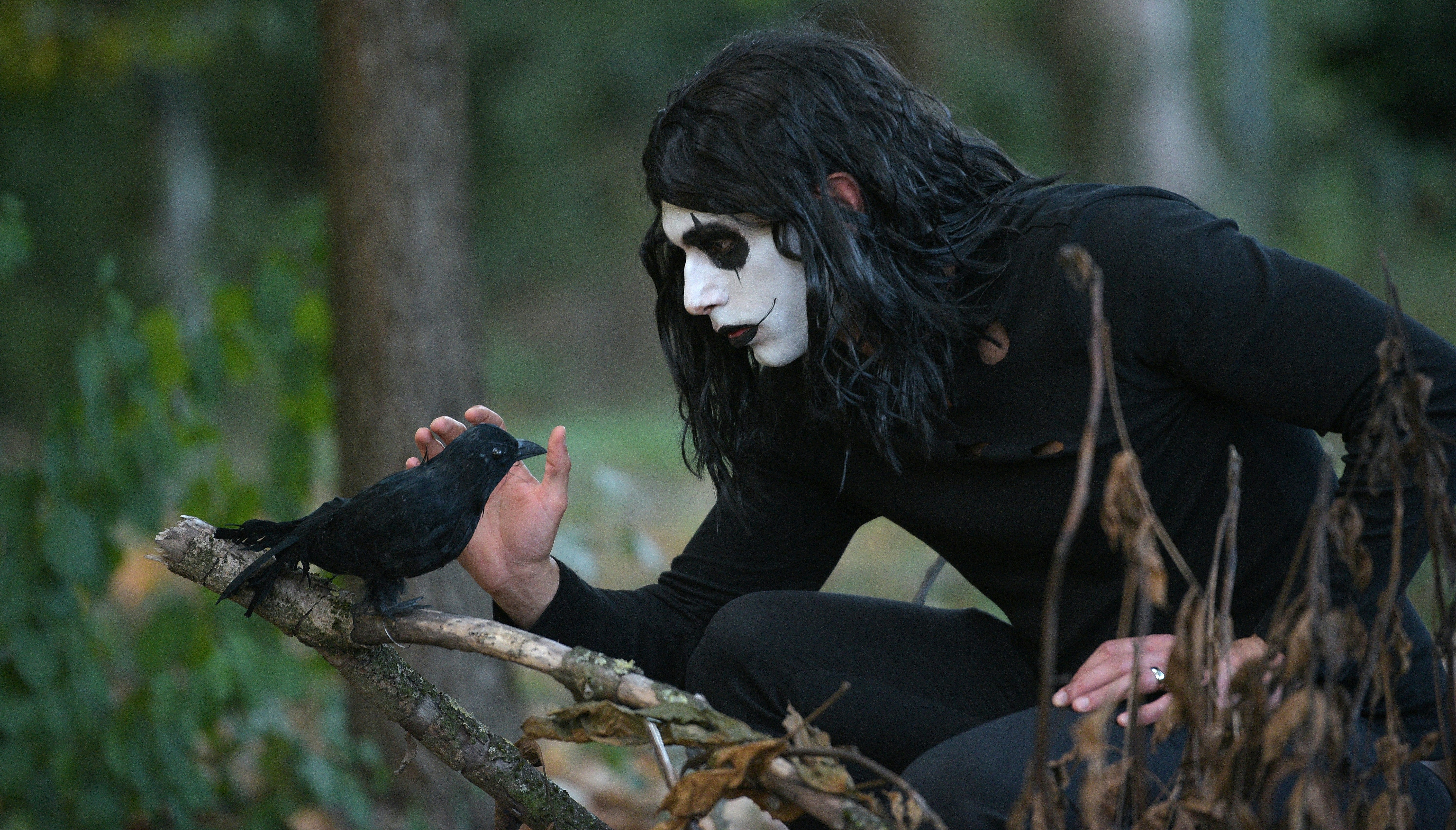 Moonlit Mime with a Black Rose: A Quiet Encounter in the Pines