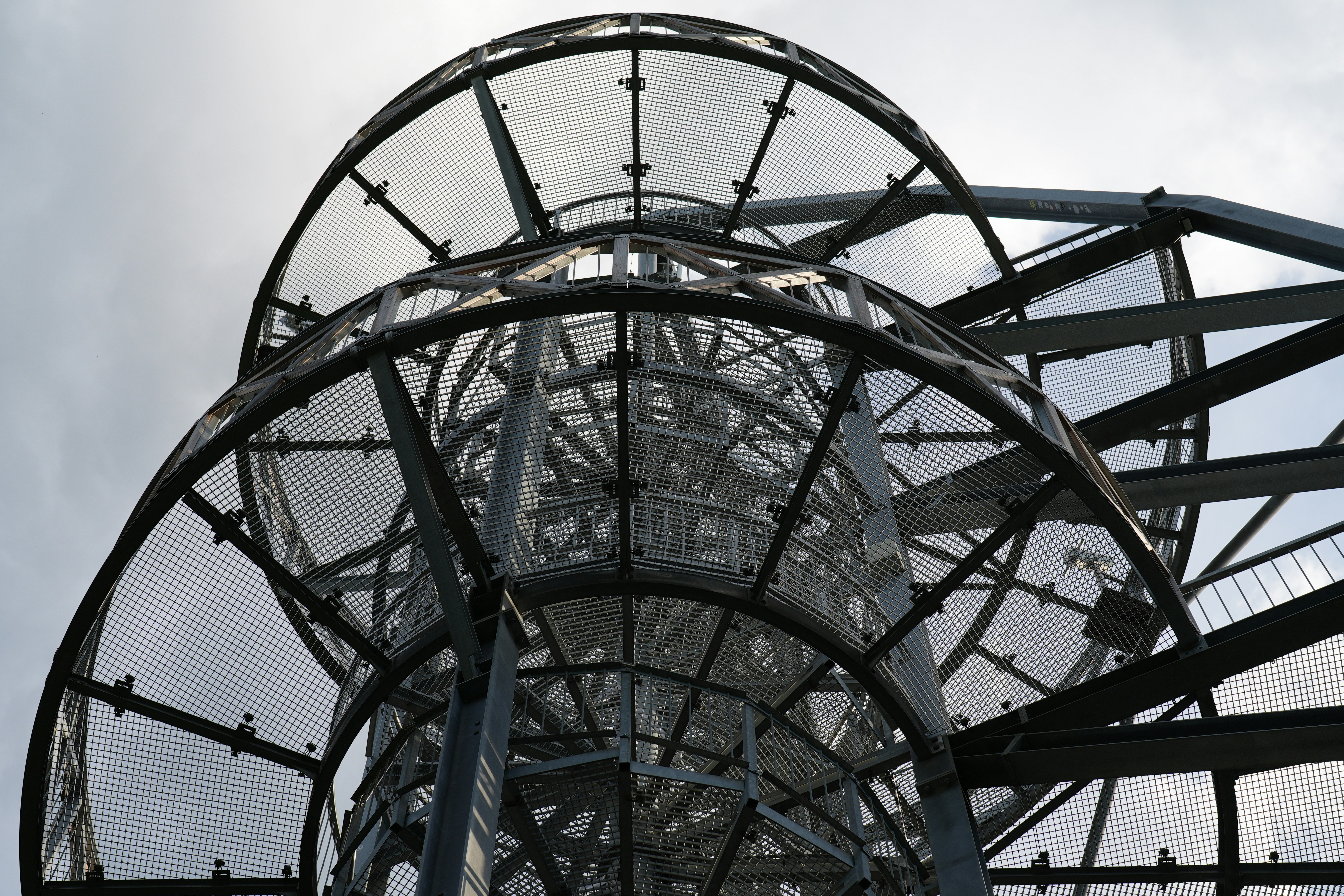 Spiral Steel: The Coiled Tower Against a Moody Sky