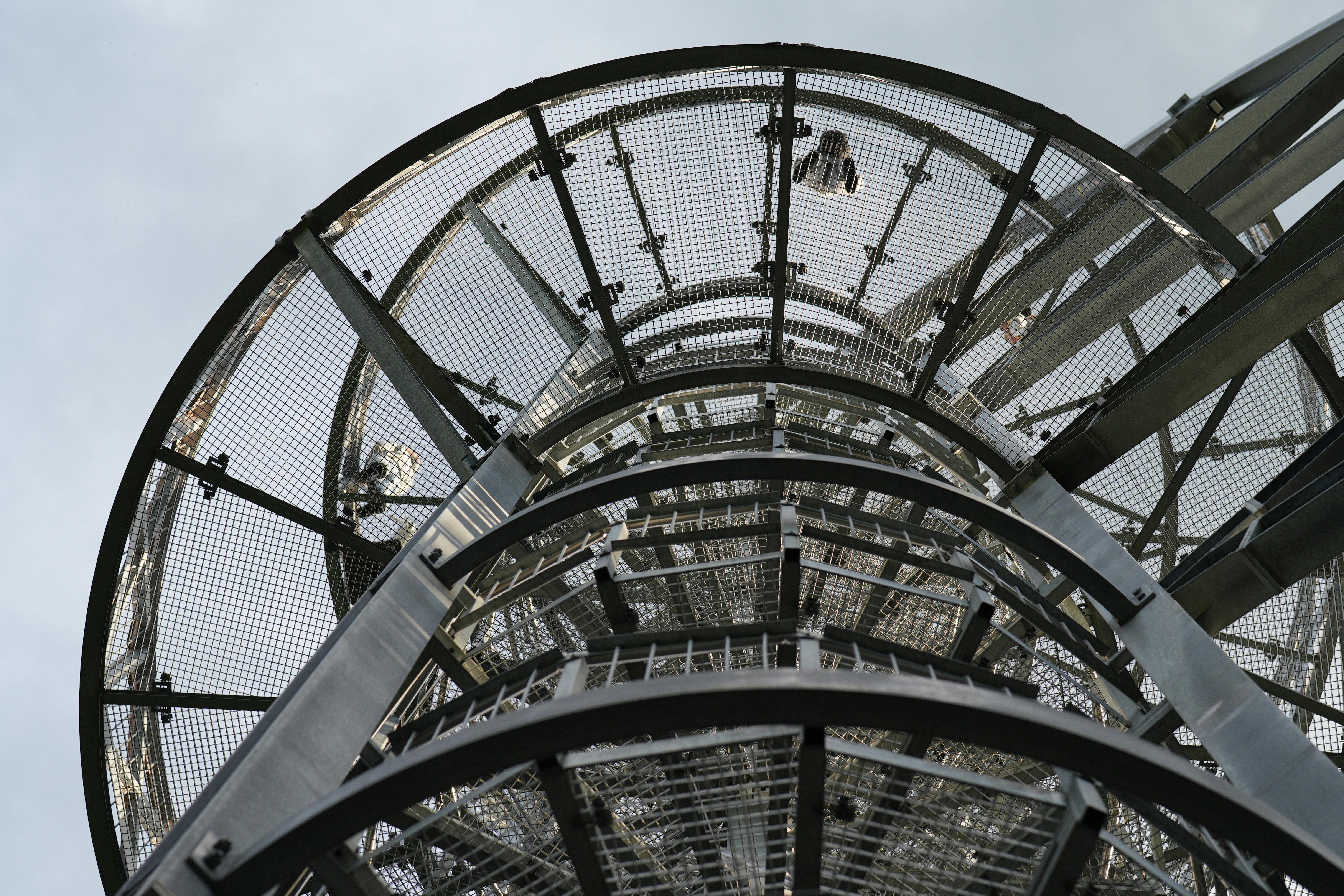 Circular Skyward: The Steel Mesh Spiral Reaching for the Clouds