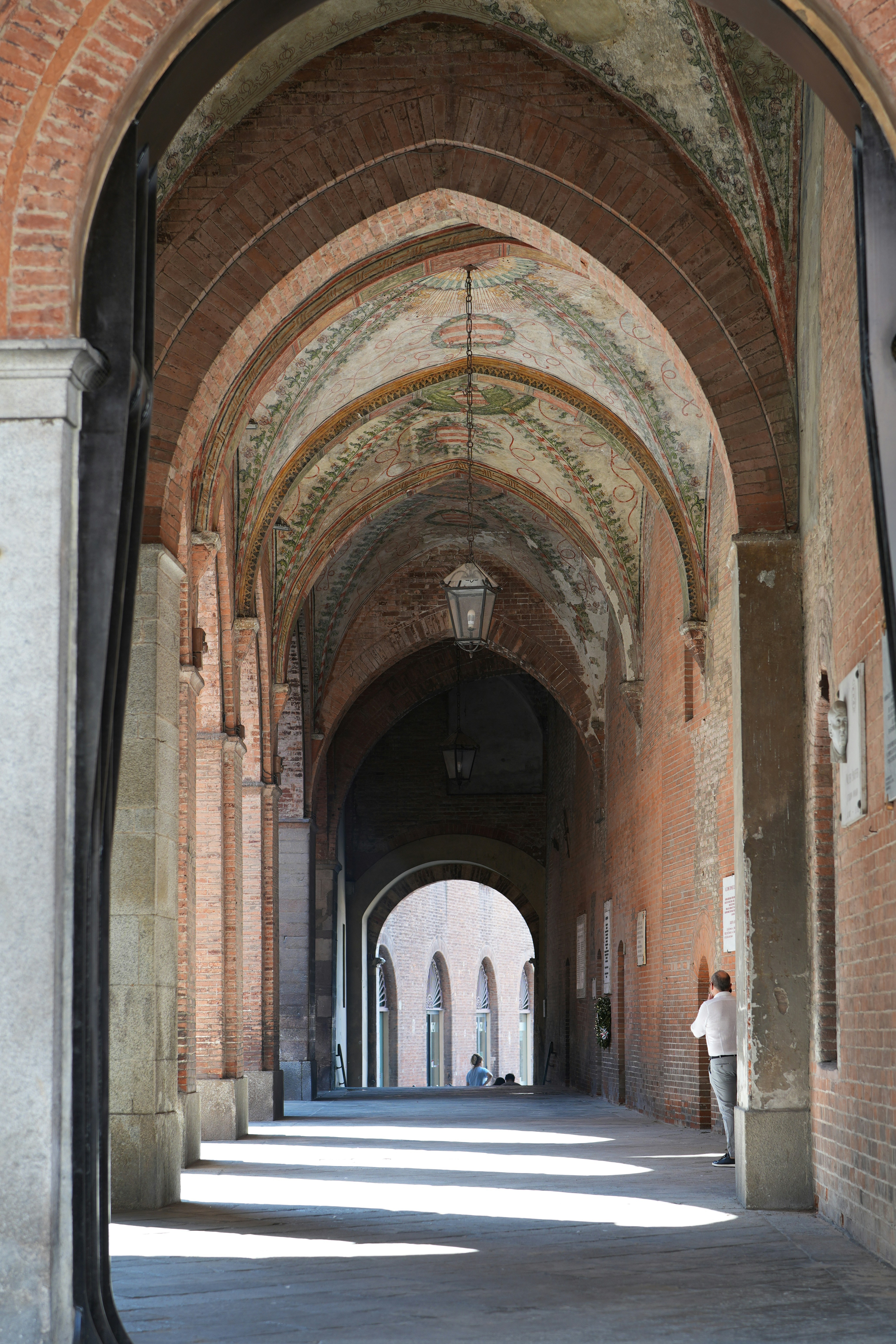 Archway Perspective: A Quiet Corridor of Brick and Light