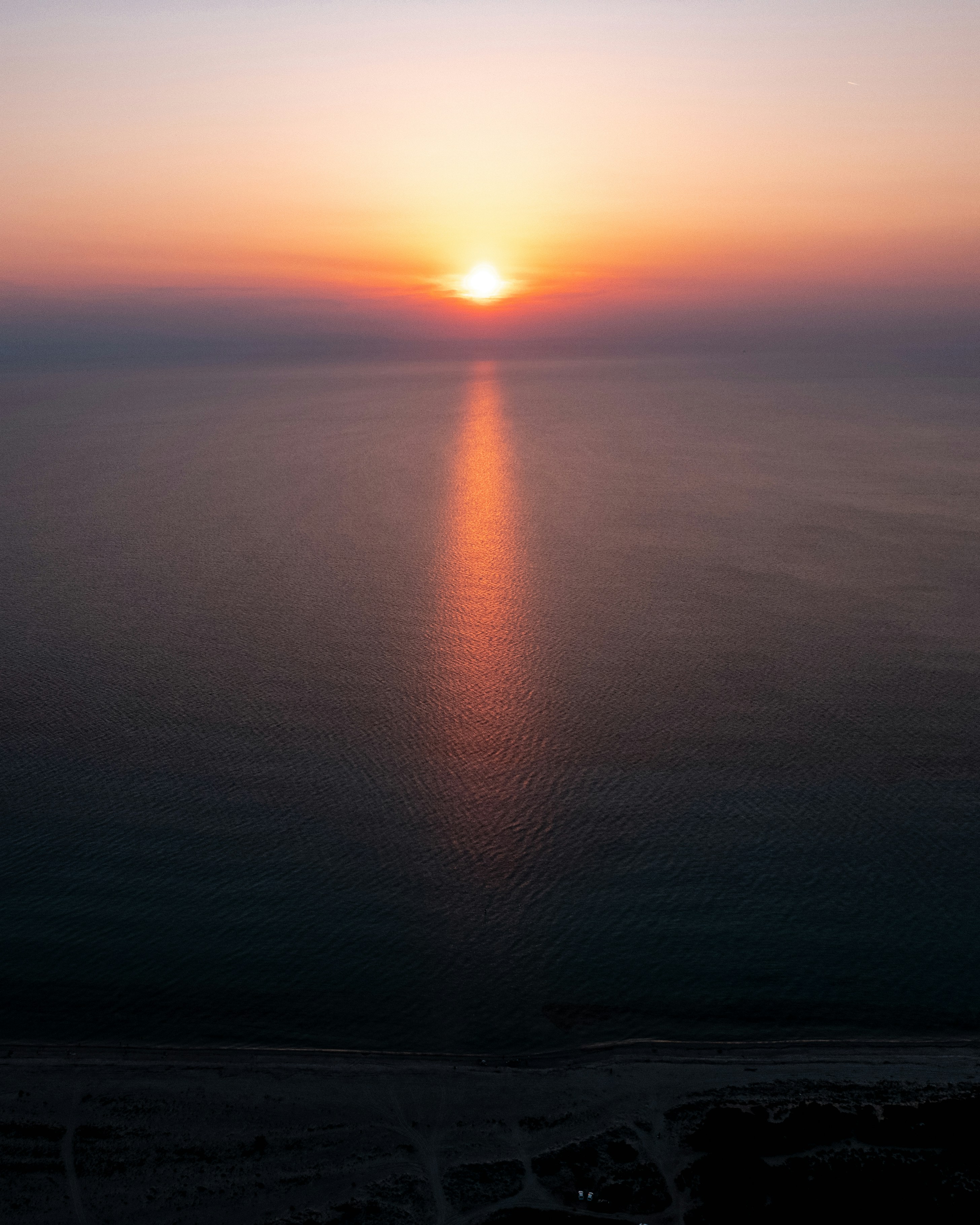 Sun-splashed Horizon: A Quiet Ocean at Dusk