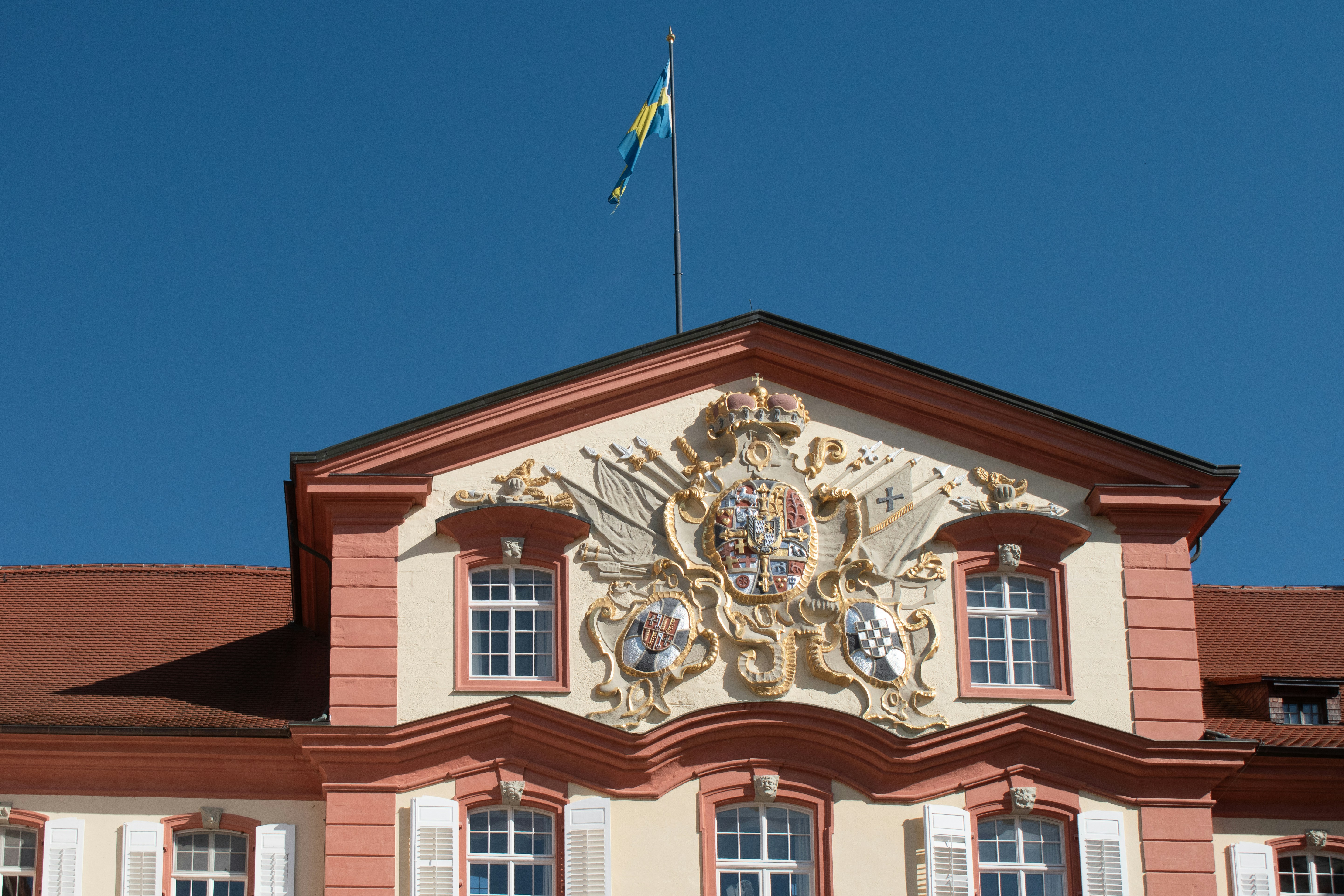 Ornate Municipal Crest Framing a Sky-Blue Day