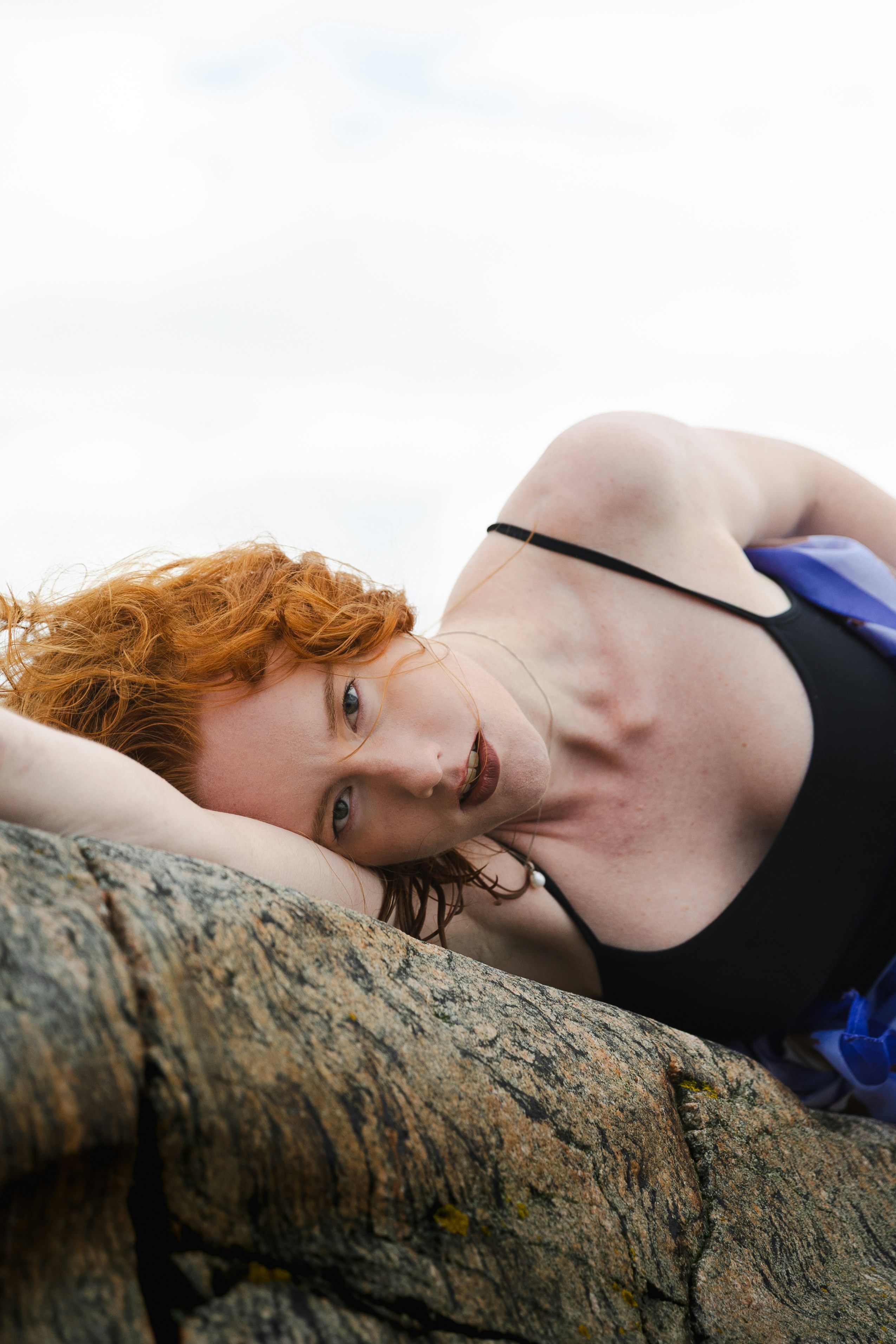 Red-Haired Contemplation on Weathered Wood