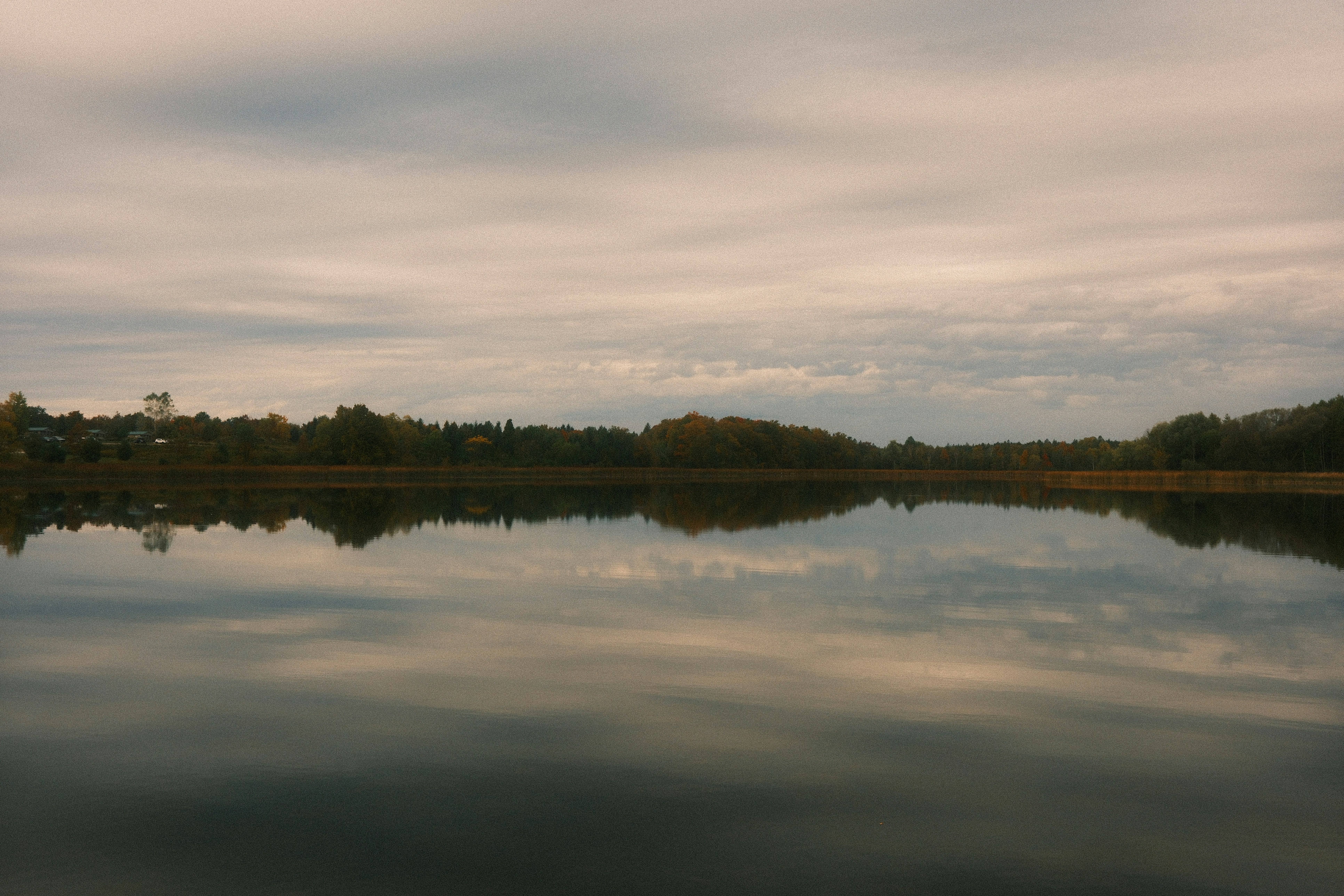 Mirror of Autumn Skies Across a Calm Lake