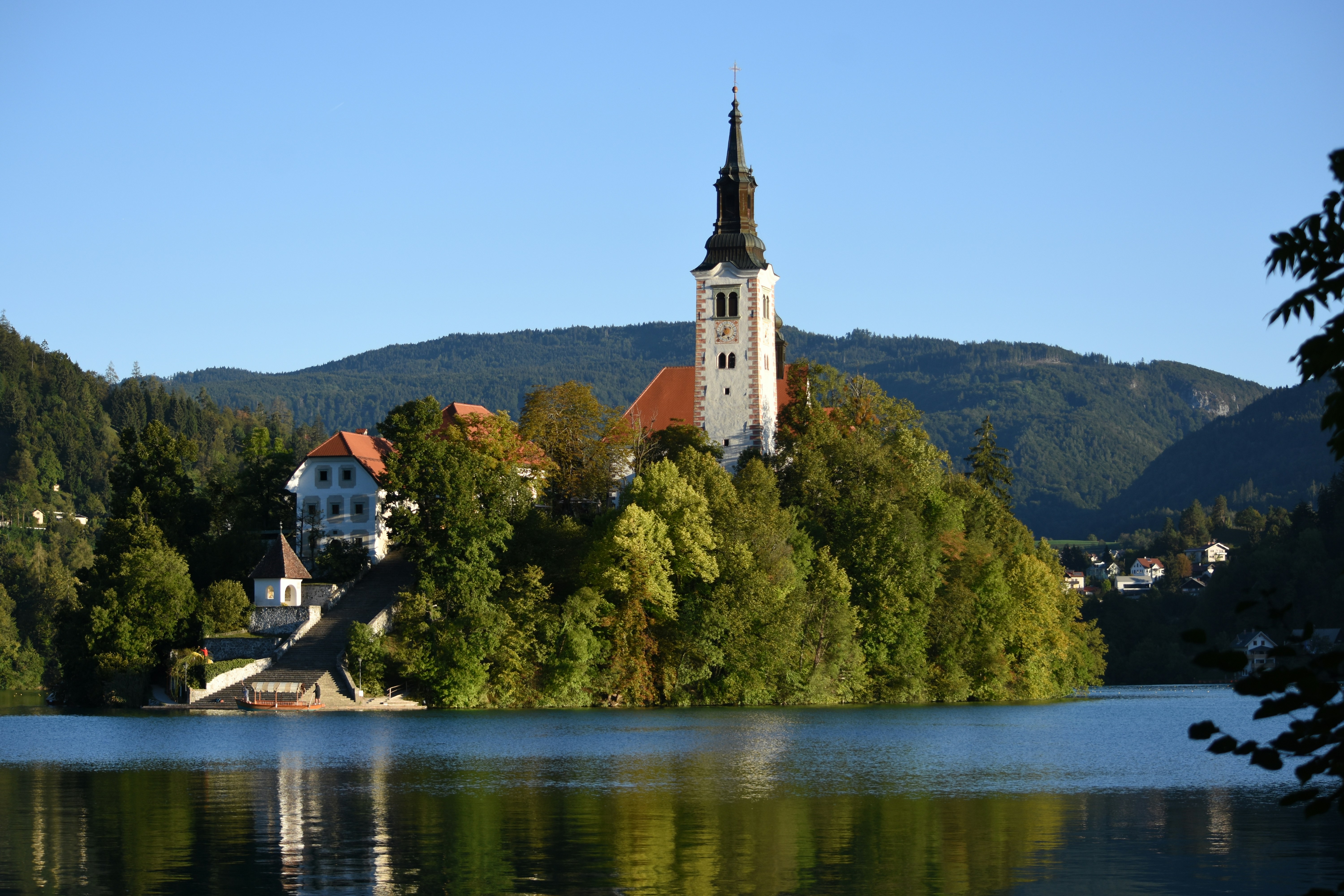 Island Church Rising from the Water under a Clear Sky