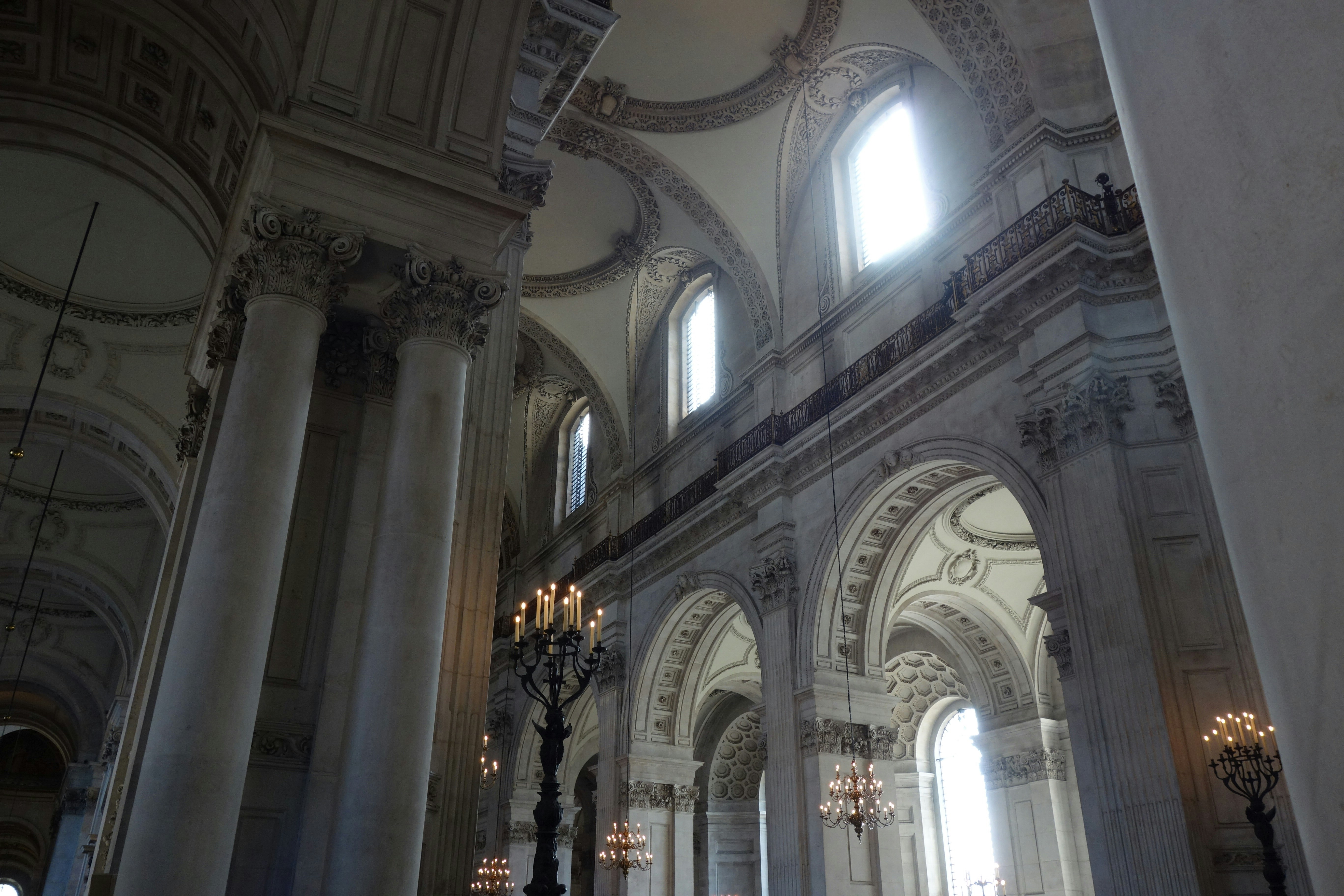 Cathedral Interiors: Light Filtering Through Arched Windows Amidst Baroque Grandeur