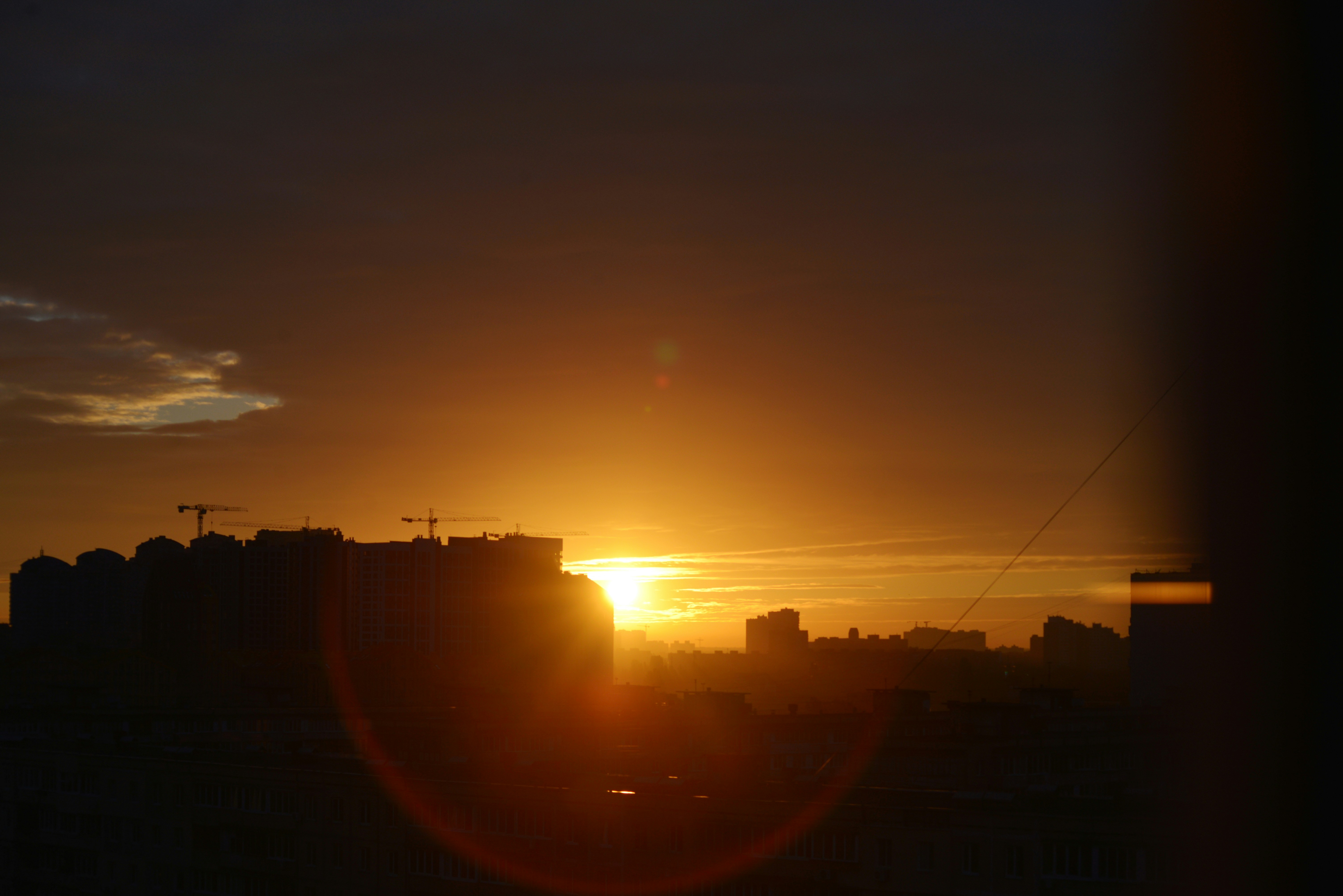 Sunrise Over Low Skyline: A Quiet City Awakens
