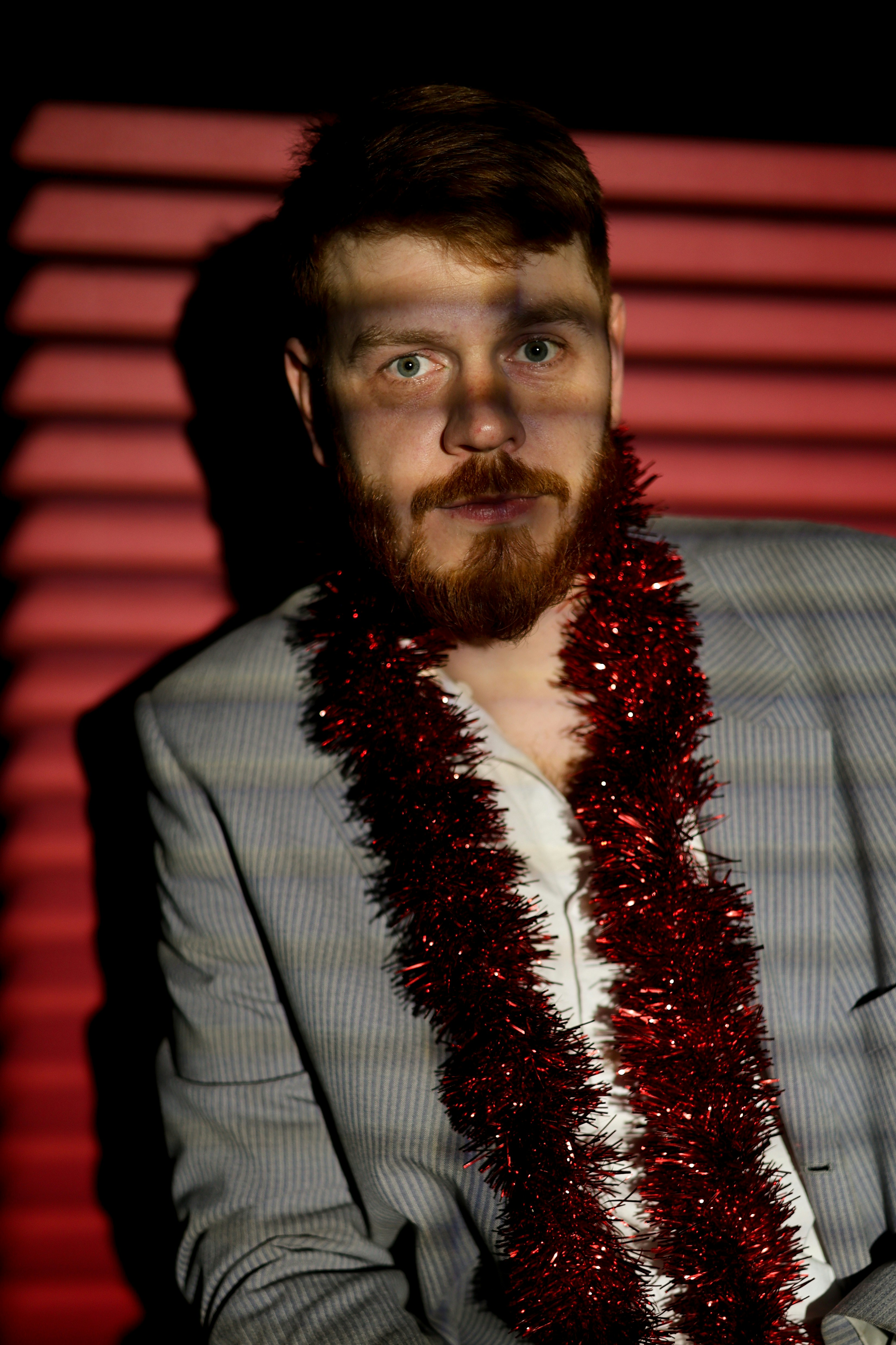 Bearded Portrait Under Neon Ribbons
