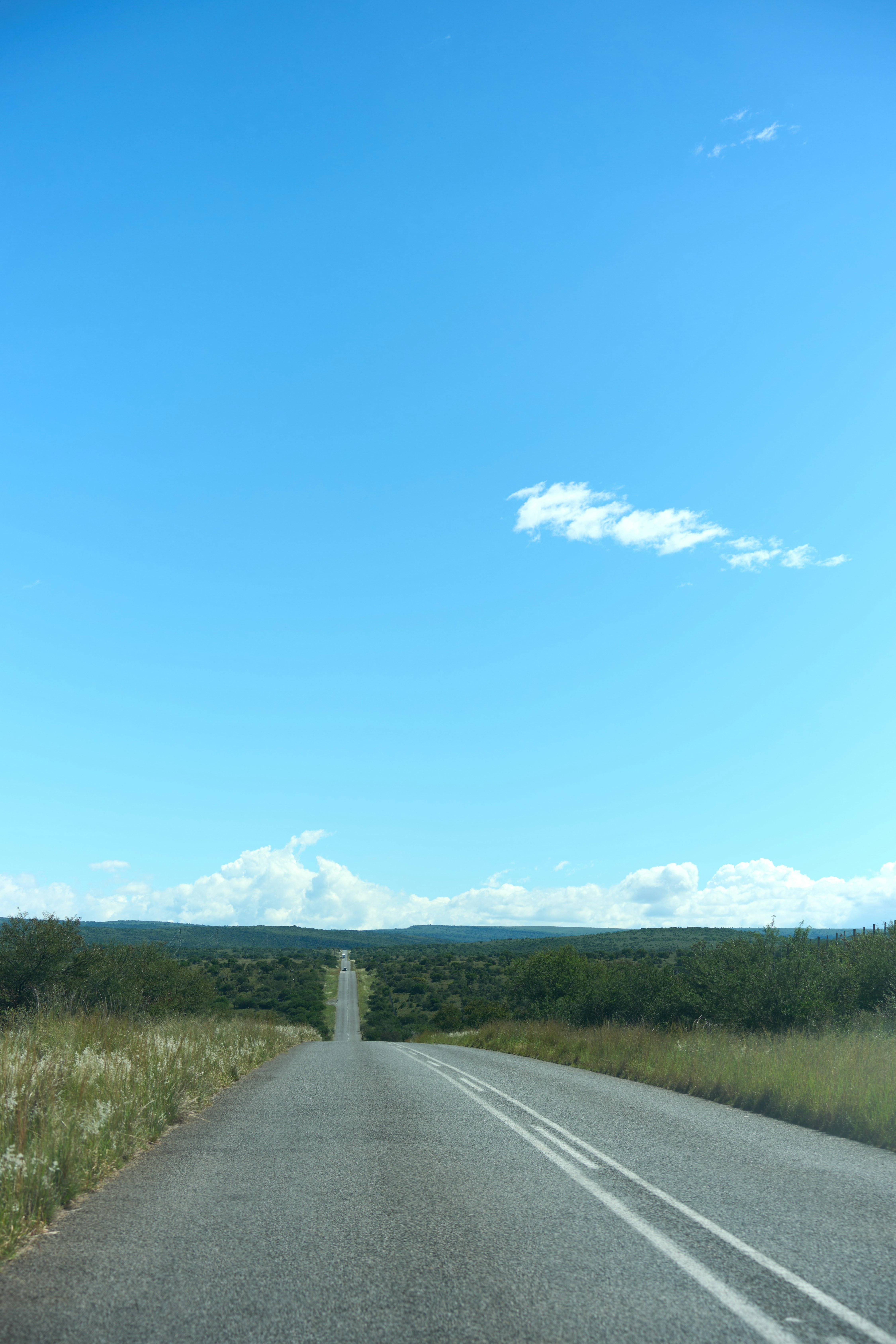 Endless Road Under a Crisp Blue Sky