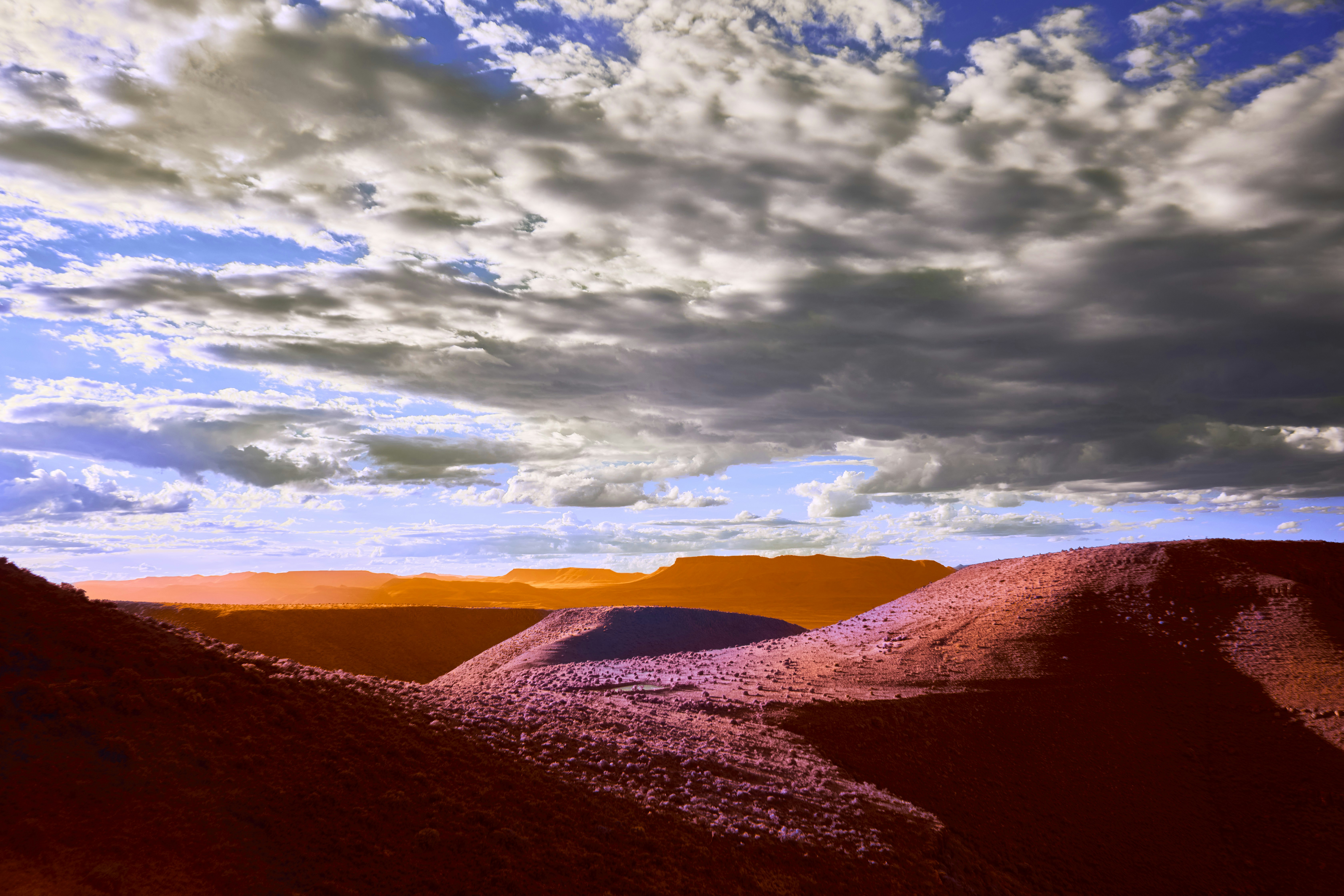 Crimson Dunes Under a Vast Sky