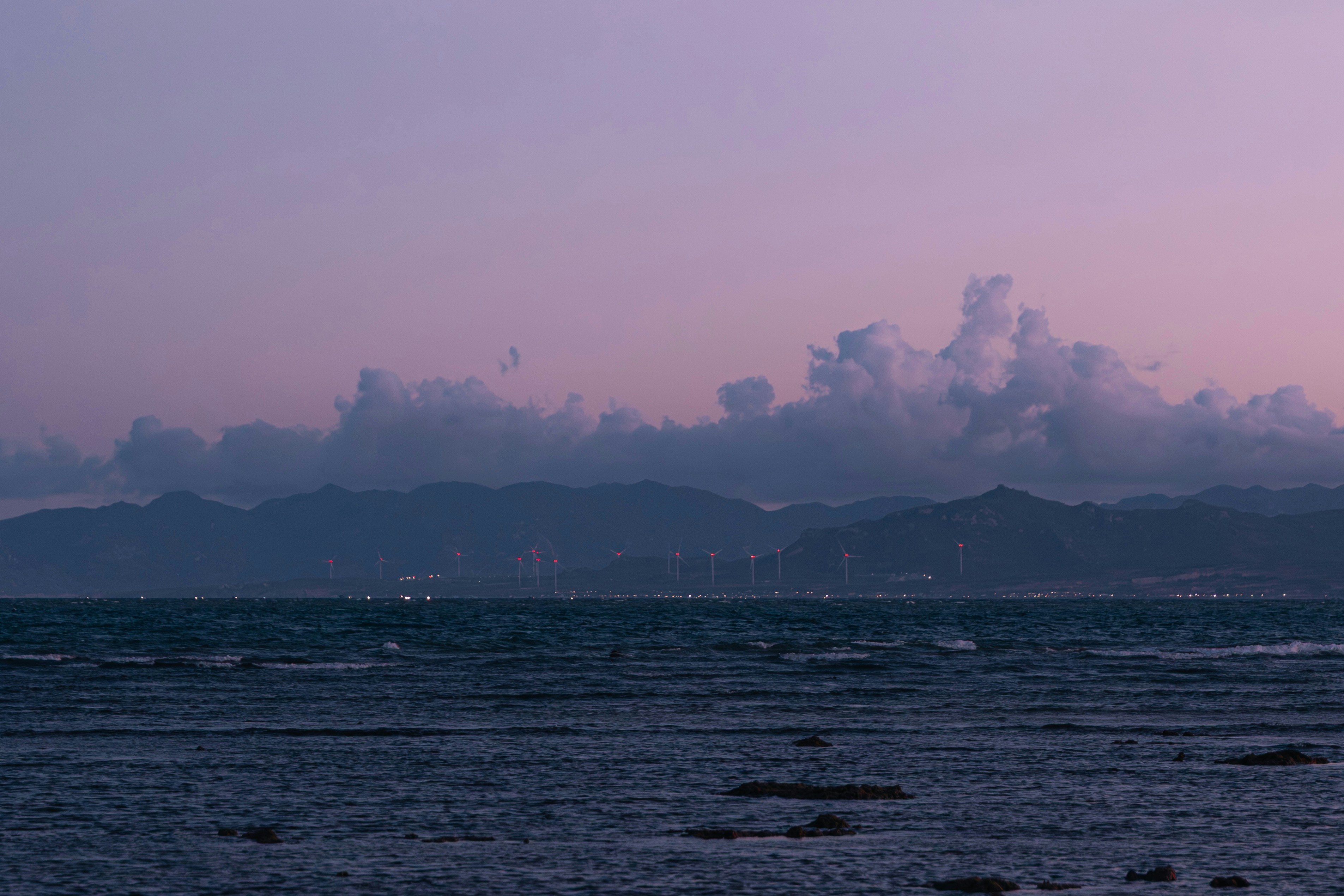 Dusk Over Quiet Offshore: Silhouettes of a Distant Ridge