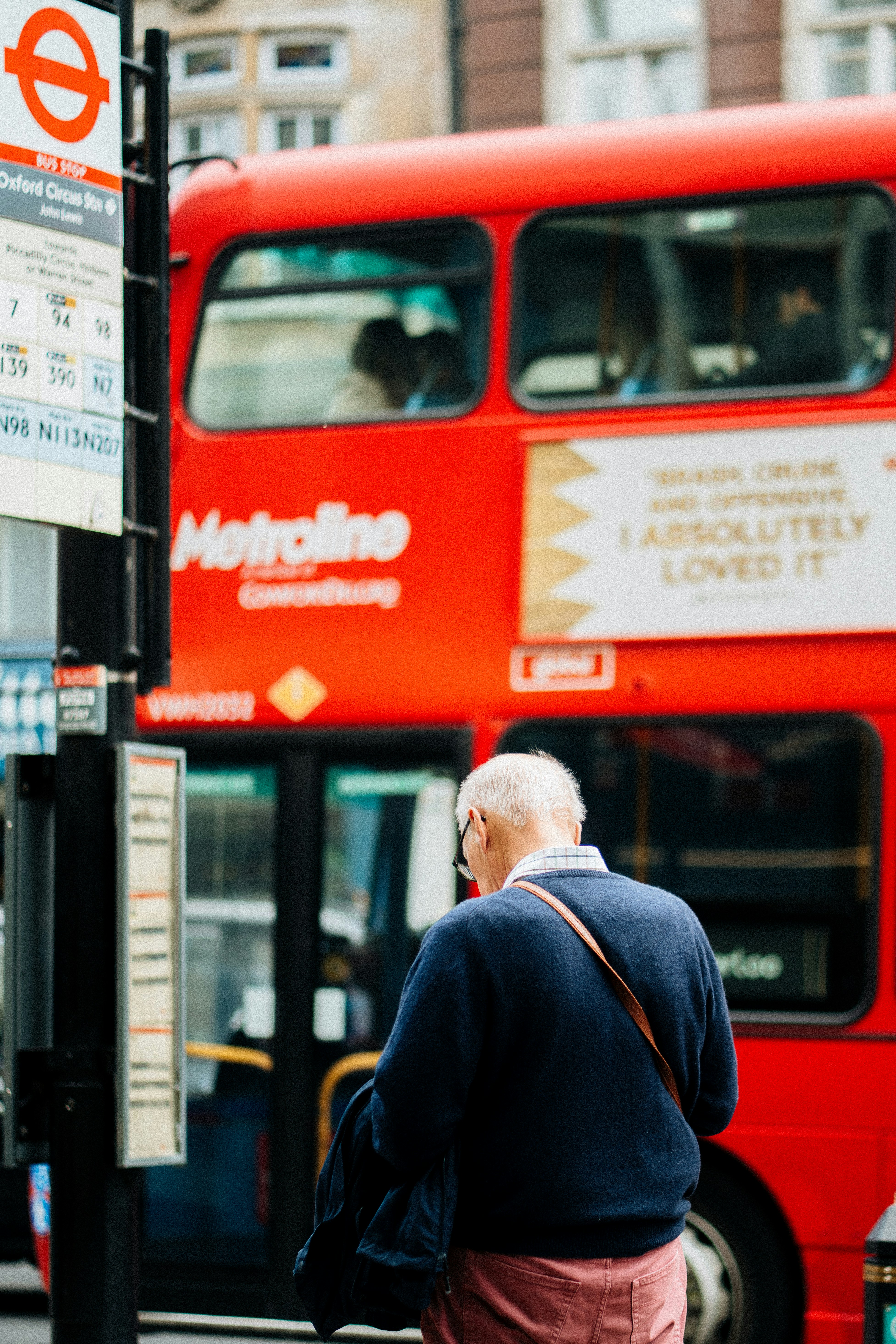 Traveler in the Red Morning: A Closer Look at a City Bus