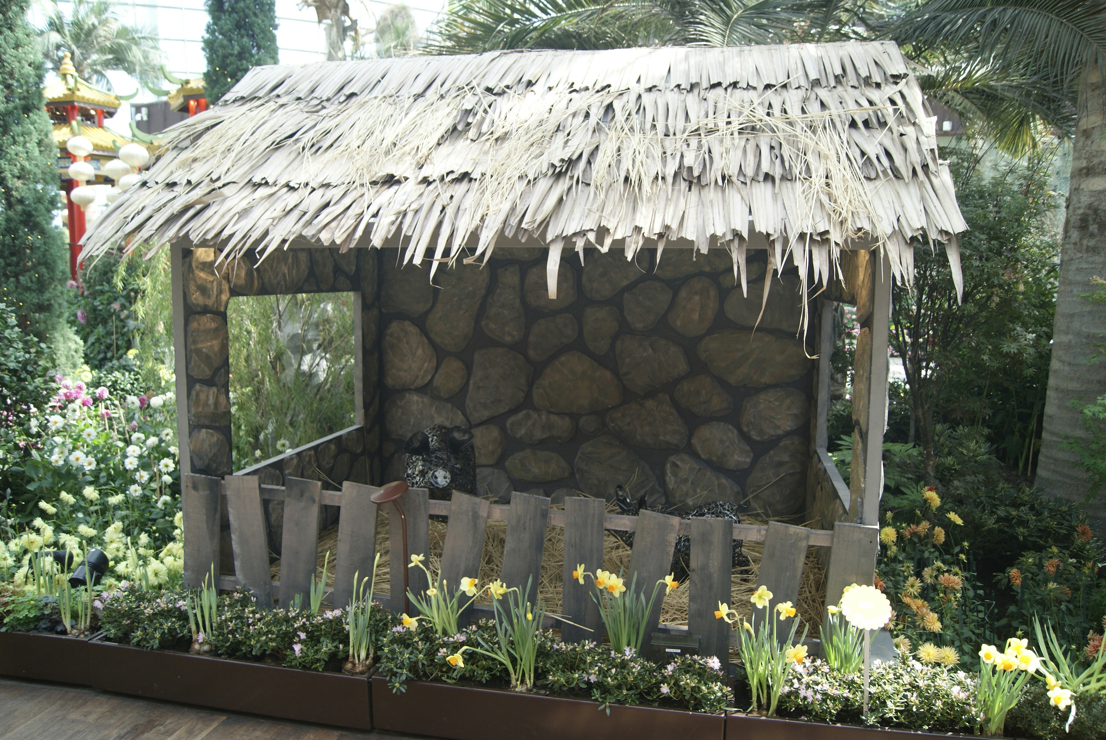 Thatched Hut in a Colorful Tropical Garden