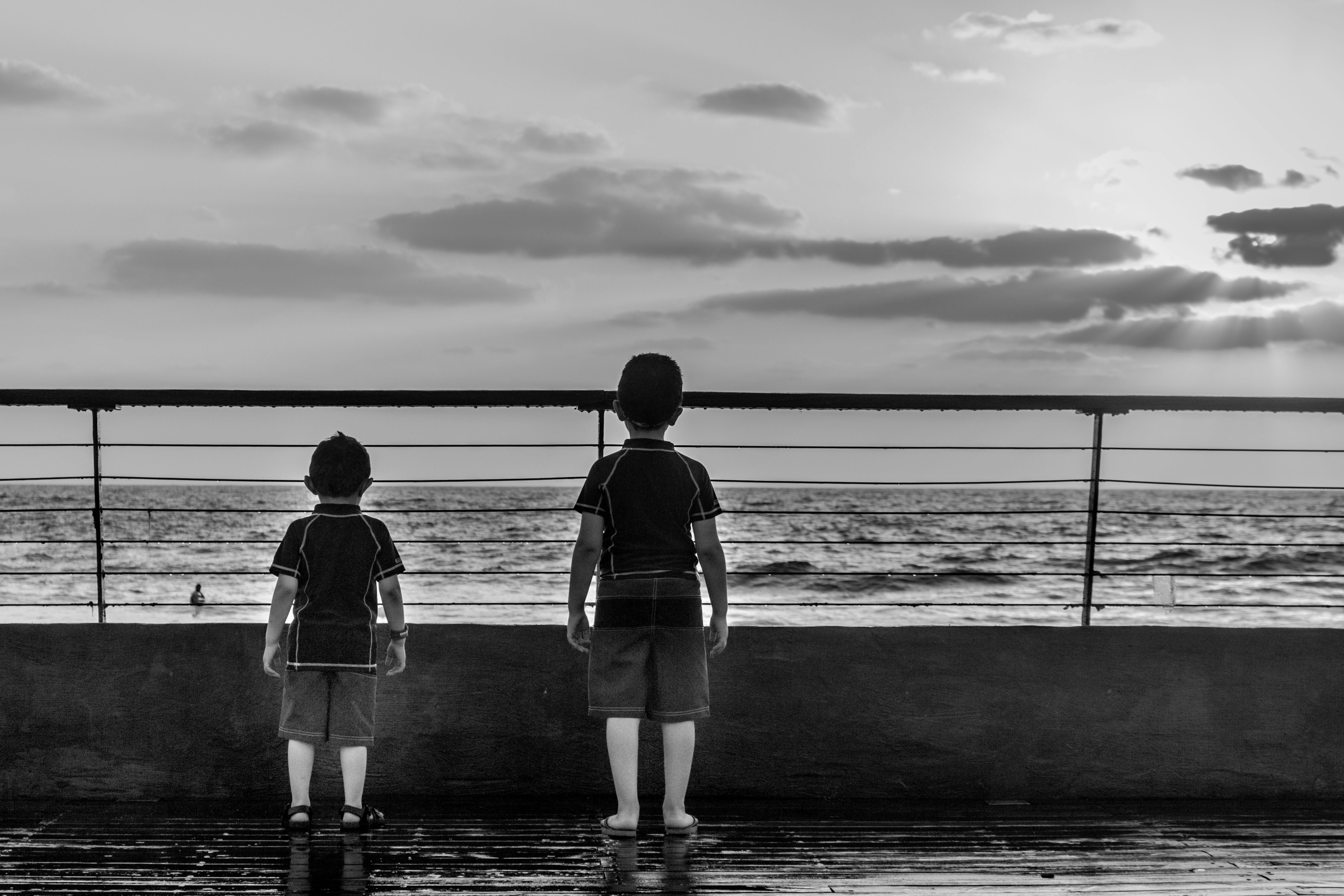 Two Figures on the Docks at Dusk