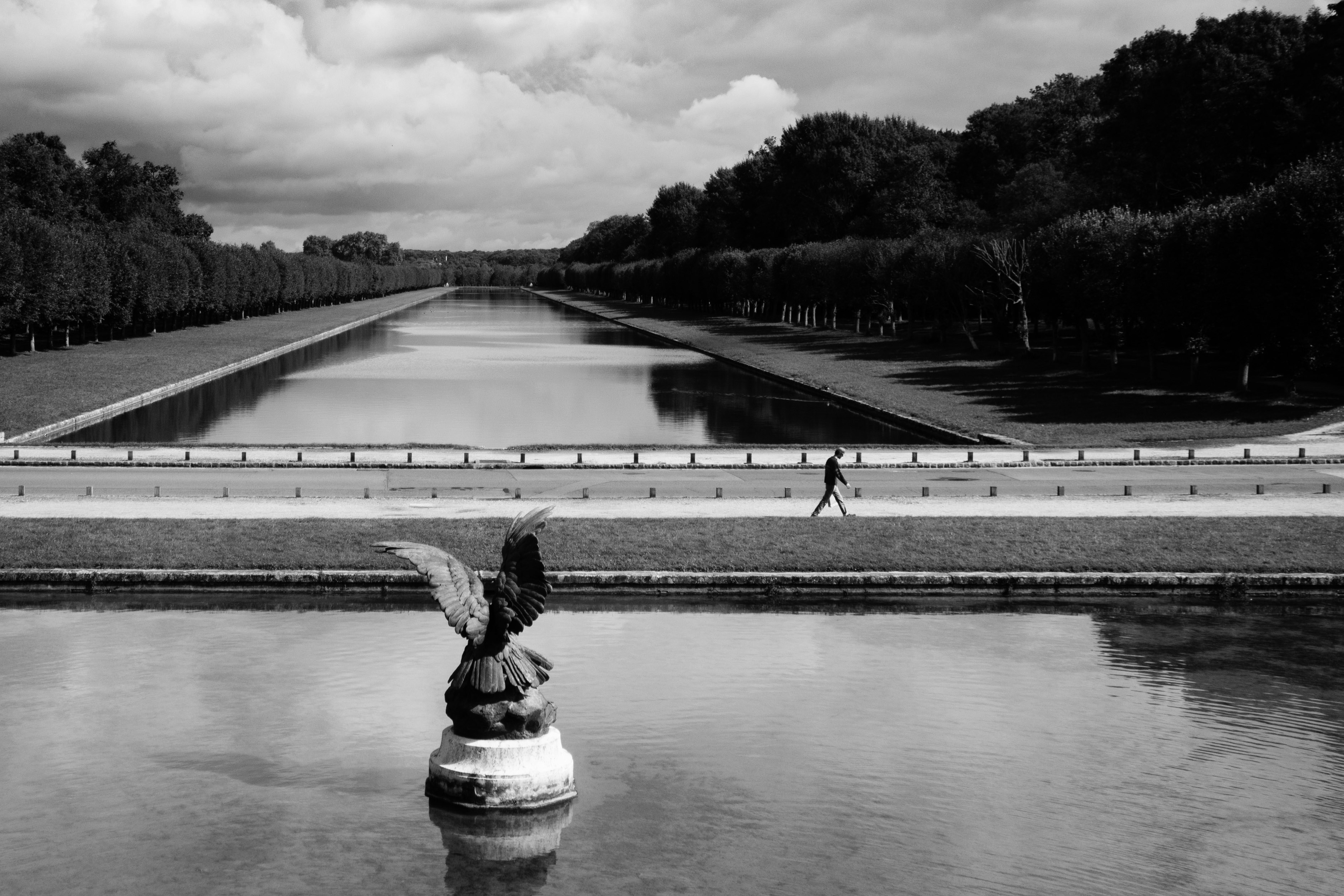Monumental Winged Base Over a Reflective Channel