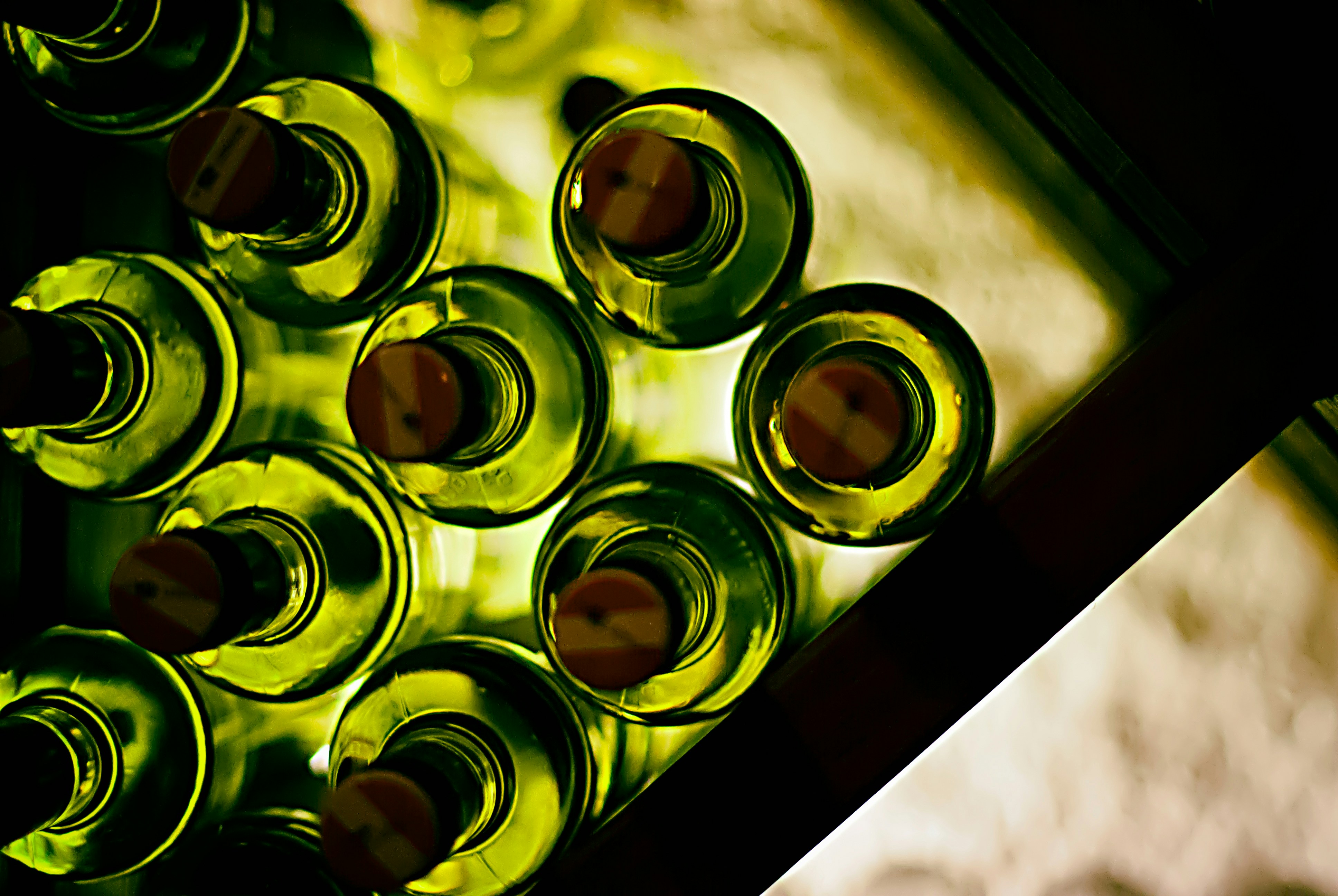 Green Glass Mosaic: A Close-Up of Bottles Refracting Light