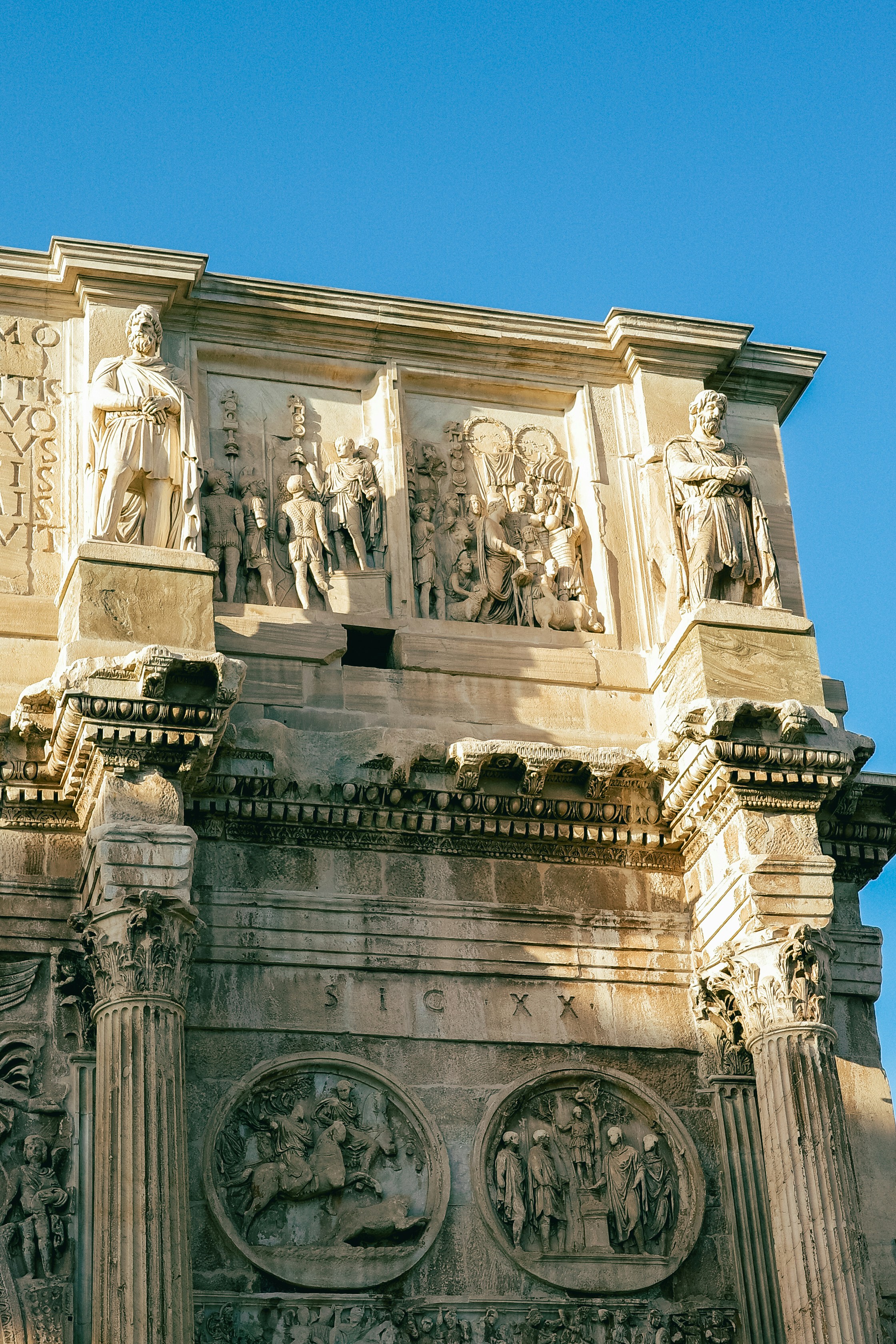 Stone Legacy: Carved Narratives Under a Bright Sky