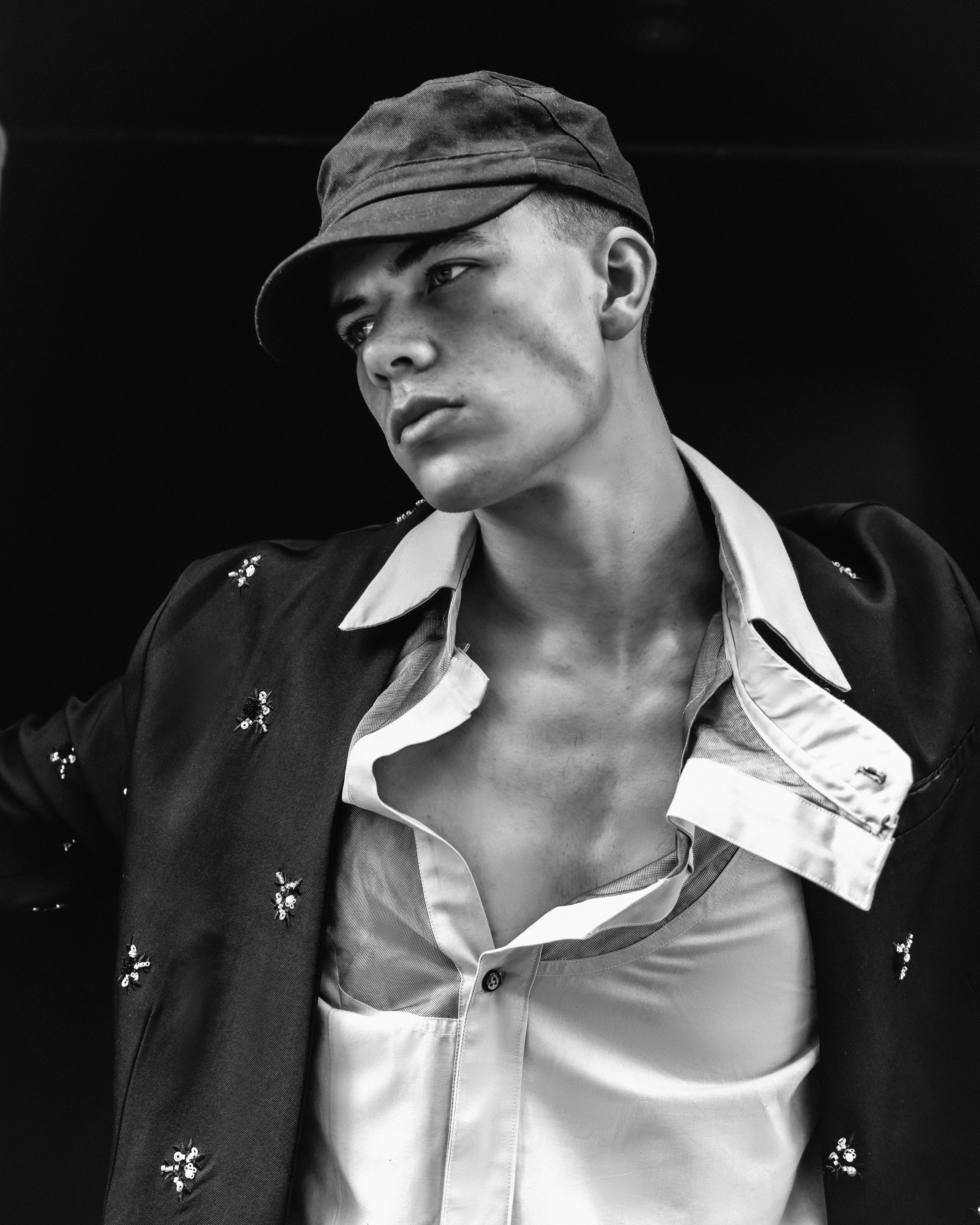 Midnight Rebel: A Studious Stare in Monochrome Noir