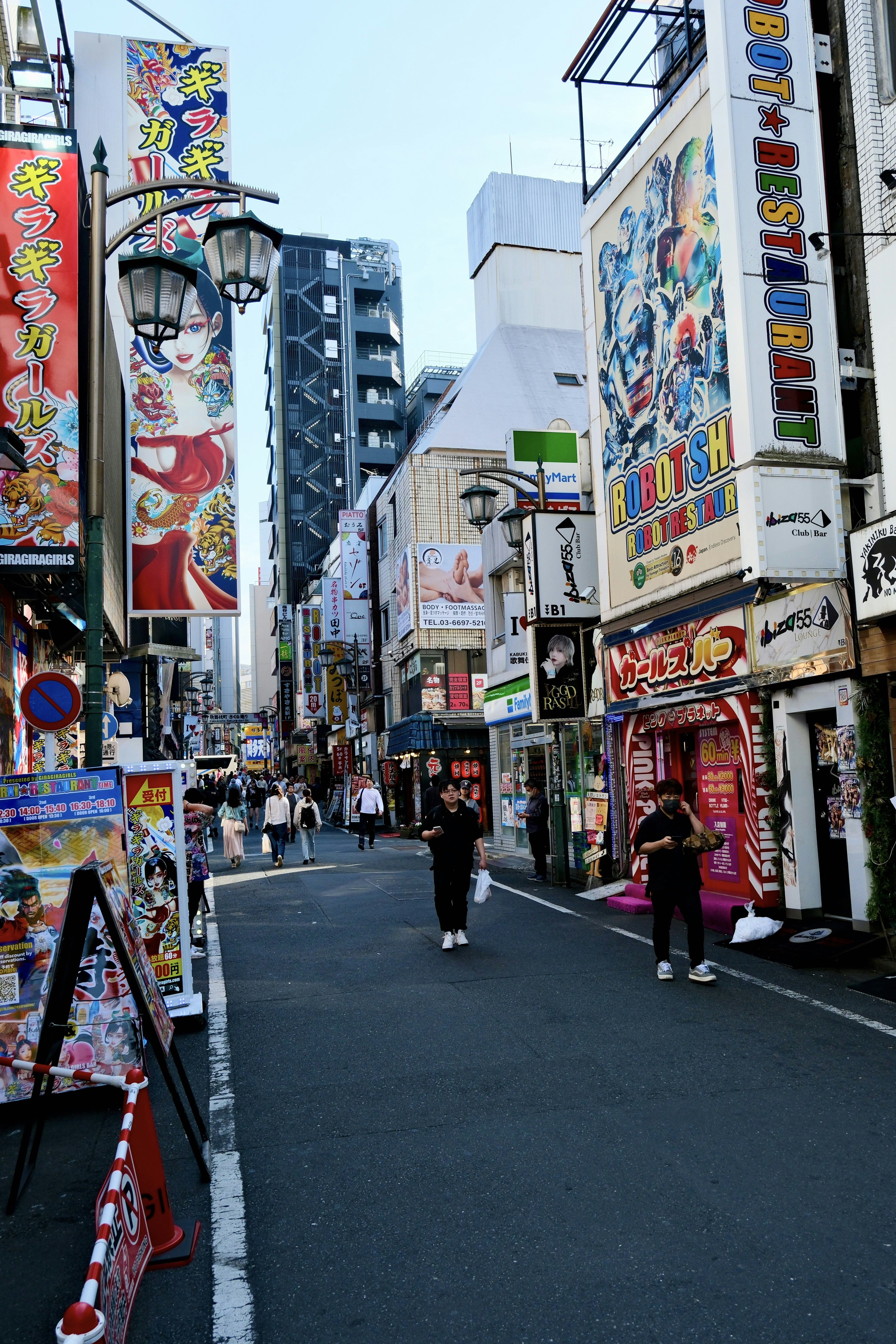 Neon Alleyway: Tokyo Street Pulse Amid Skyscraper Murals