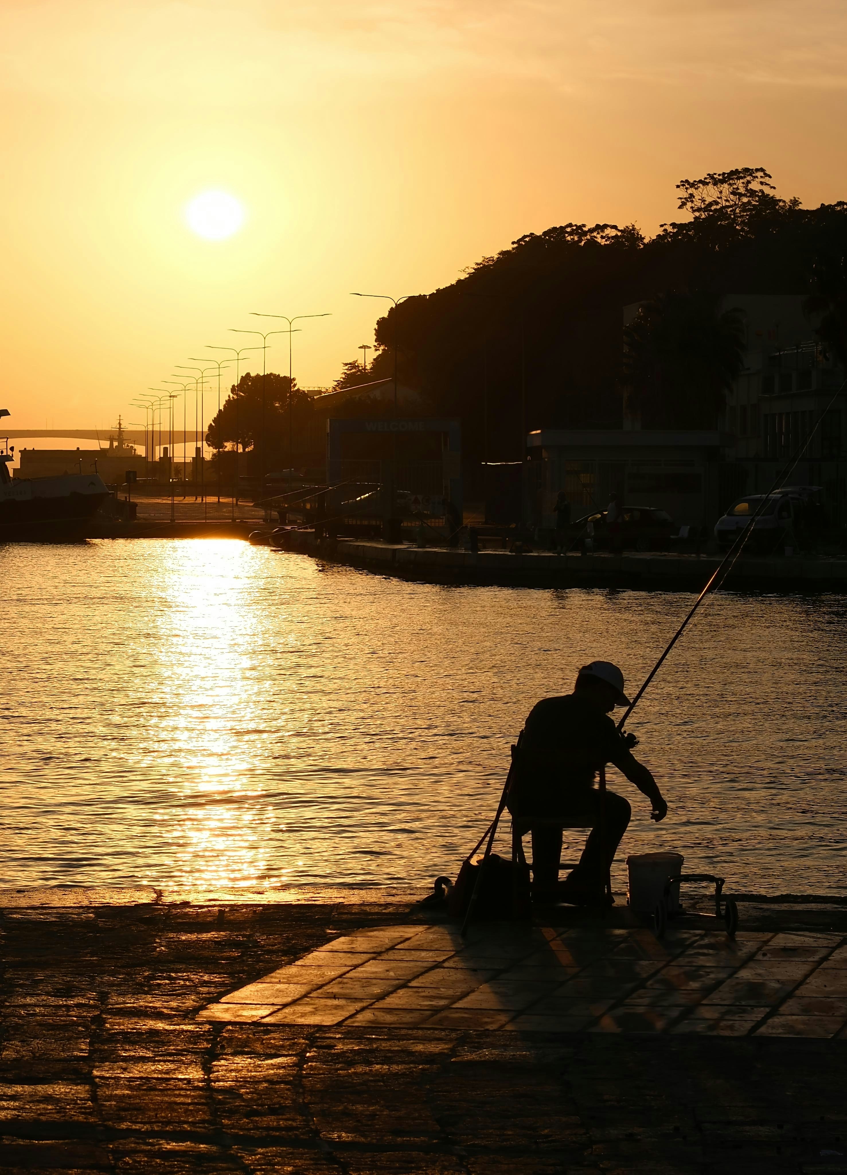 Sunset Sidebar: The Silhouette of a Fisherman at Dusk