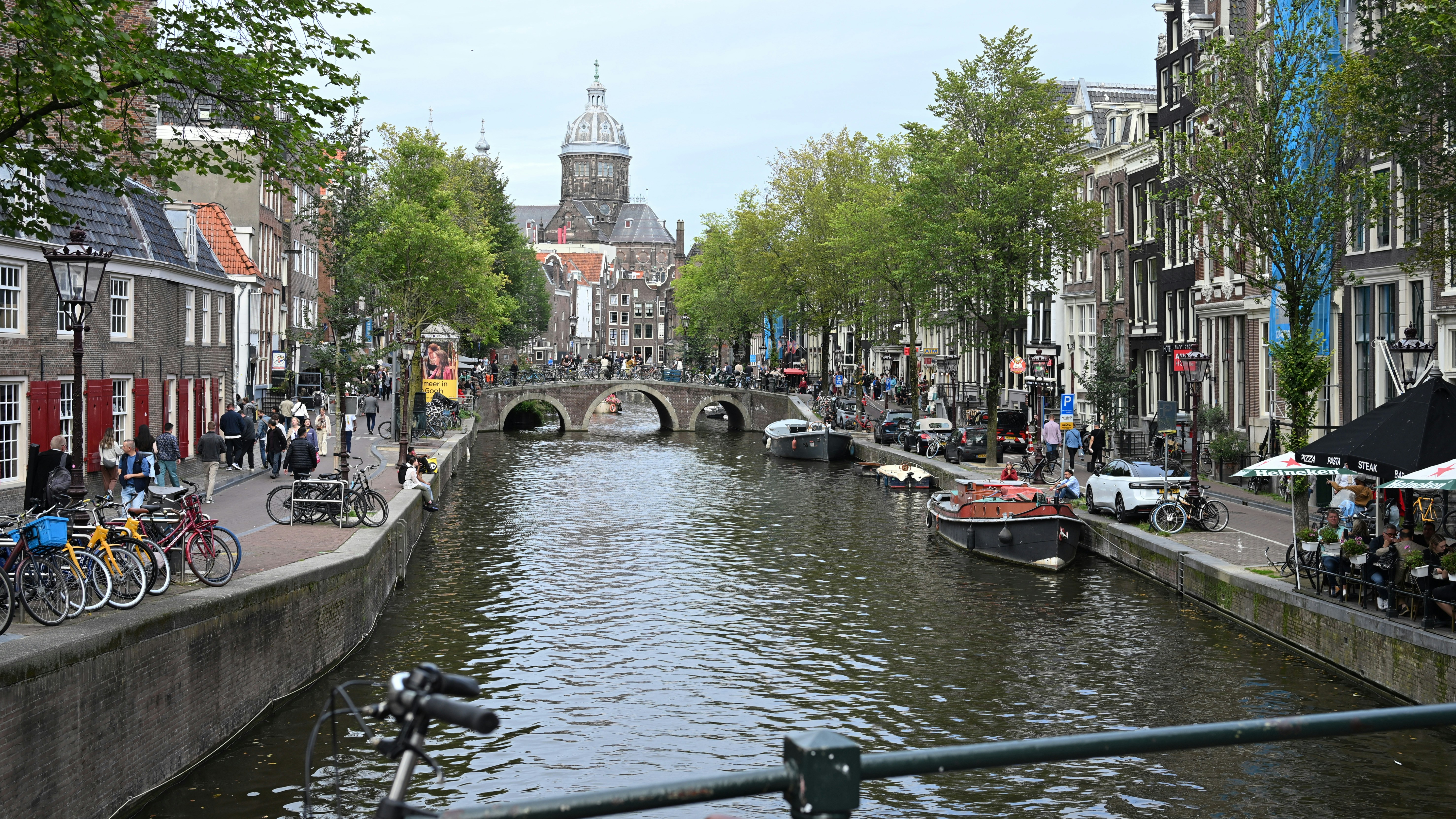 Canalway Arch: Boats, Bridges, and a Clock Tower in Amsterdam