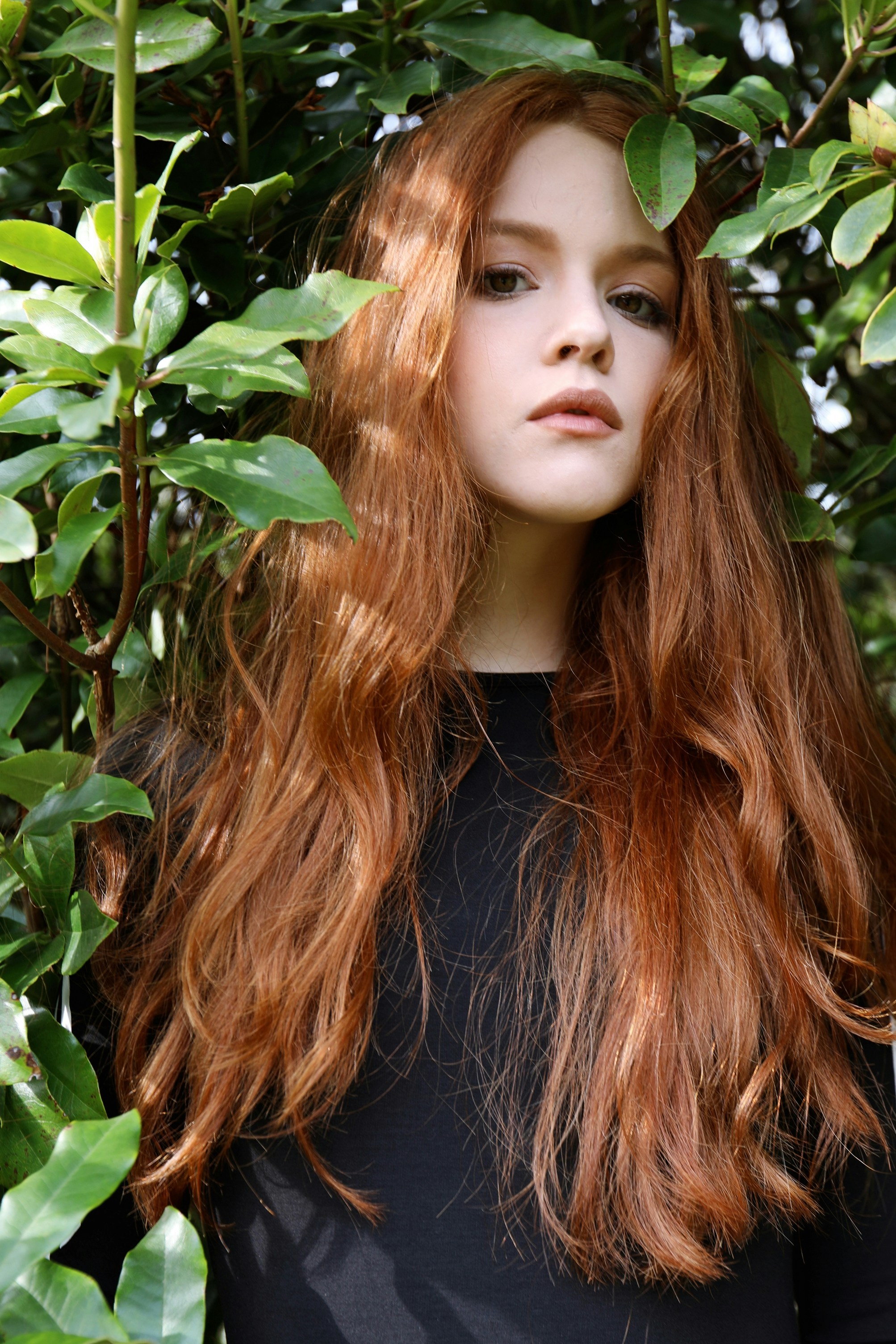 Red-Haired Portrait in a Green Canopy