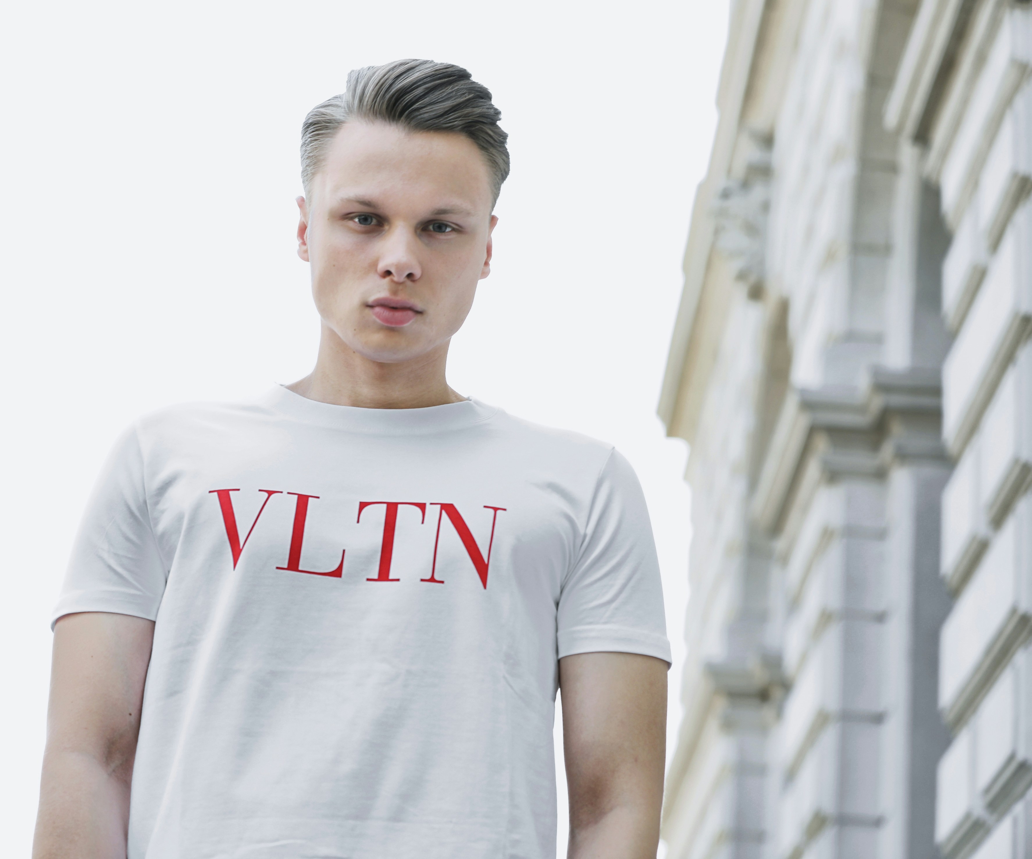 Portrait in Urban Light: The Bold Stare and Clean Typography