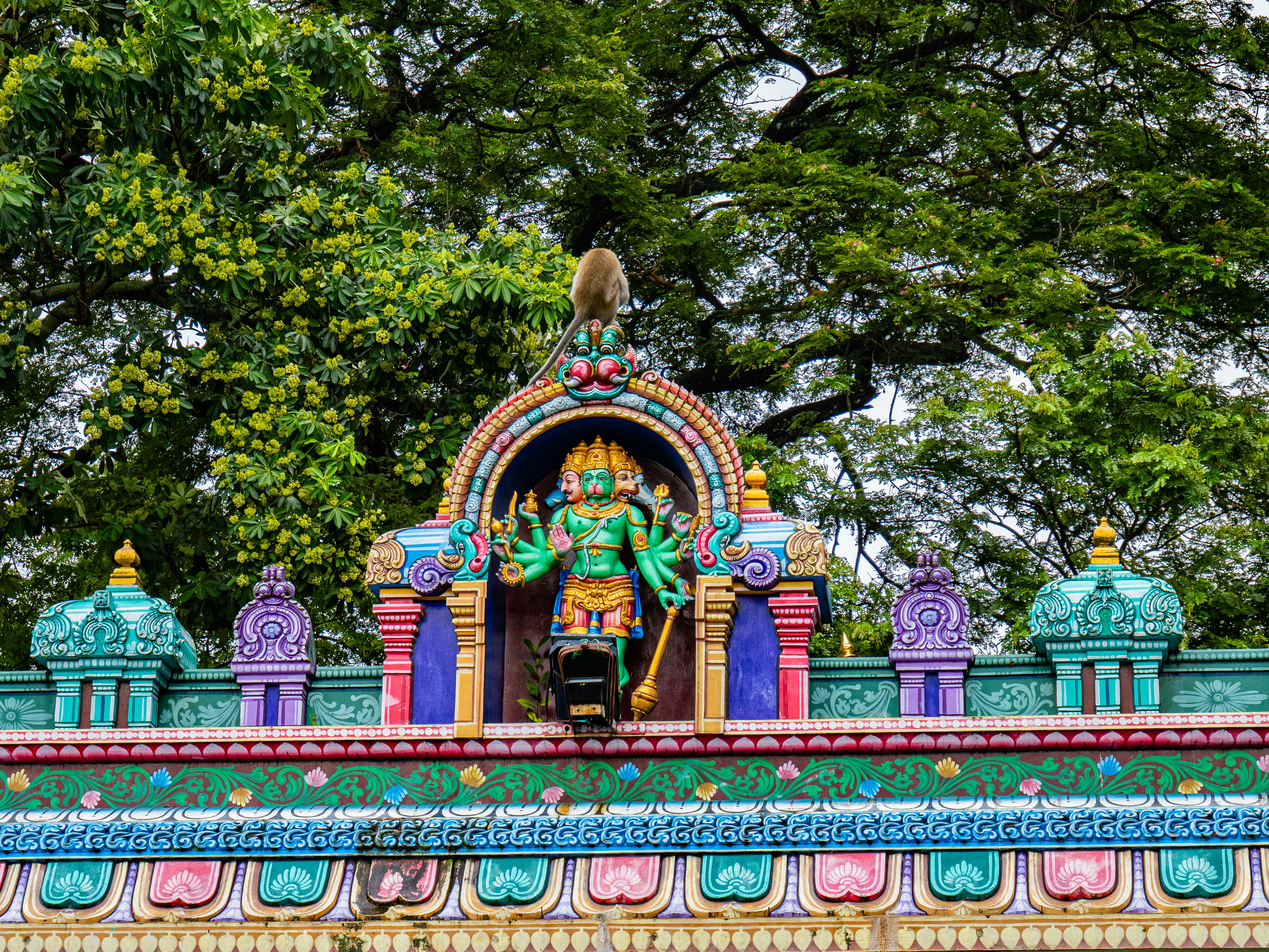 Vibrant Temple Allegory: A Ganesh-style Guardian Crowns a Colorful Archway
