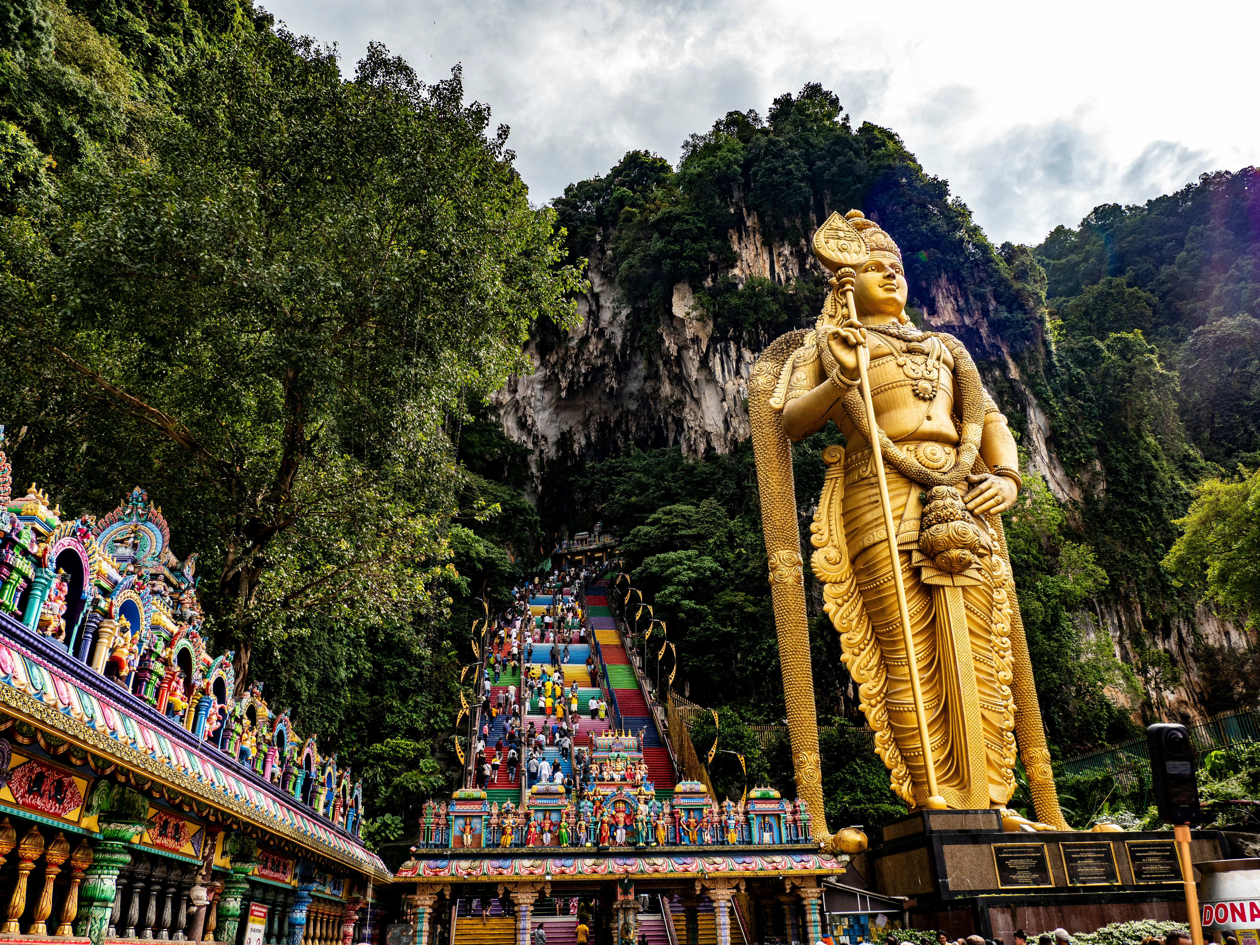 Golden Guardian at the Foot of the Sacred Steps