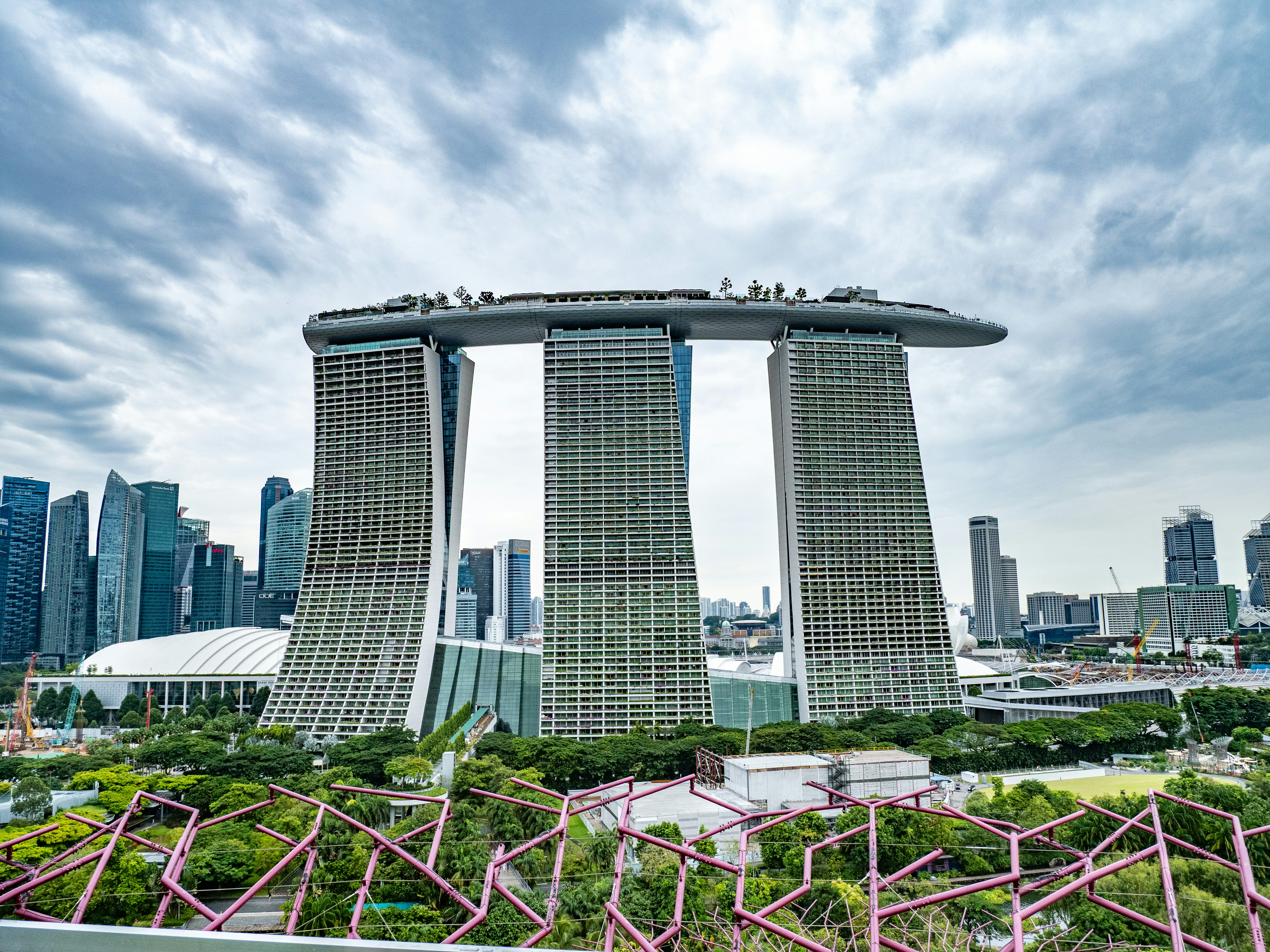 Marina Bay’s Icon: The Trident of Towers Under a Striated Sky