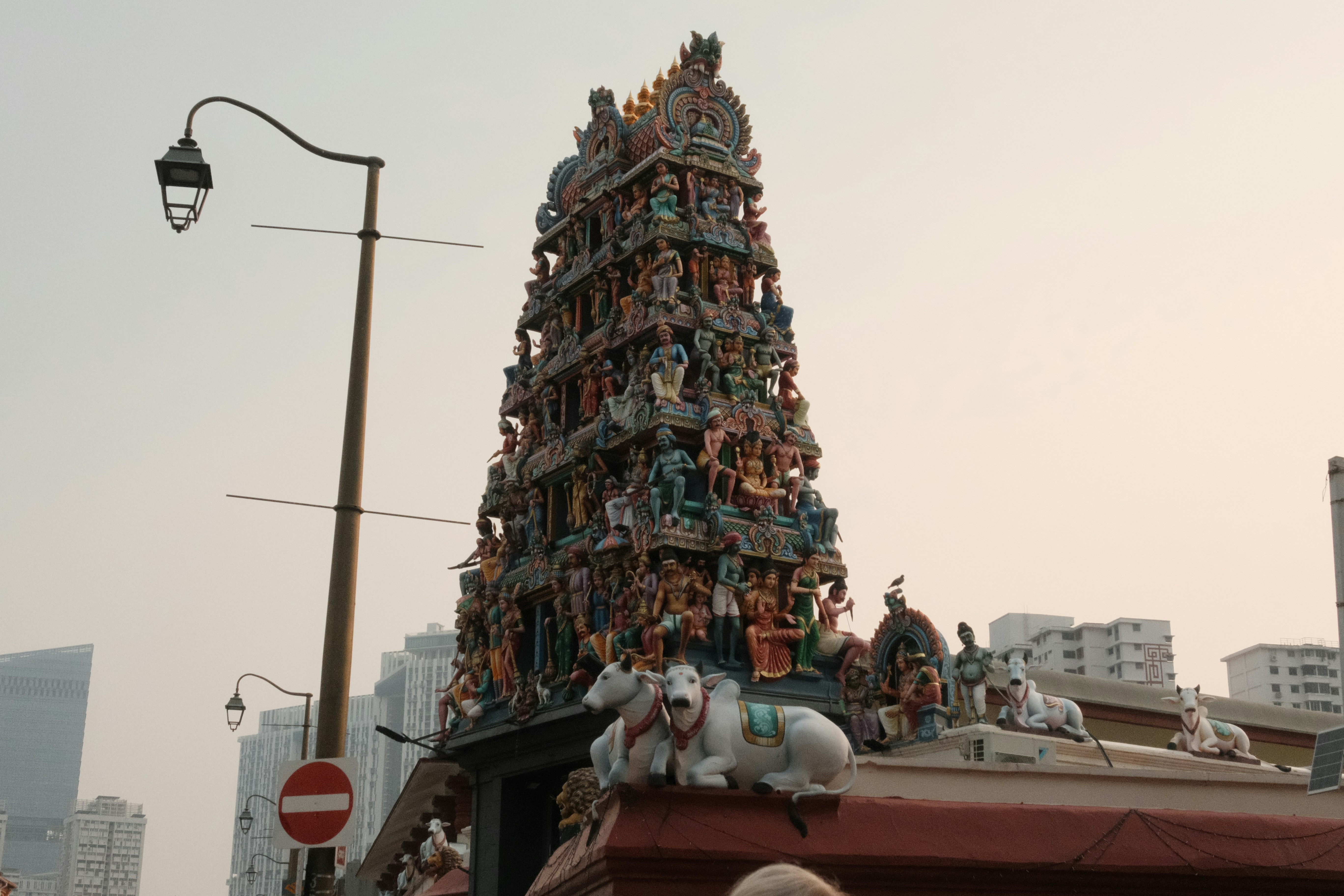 Ornate Hindu Temple Shikhara Piercing a City Sky