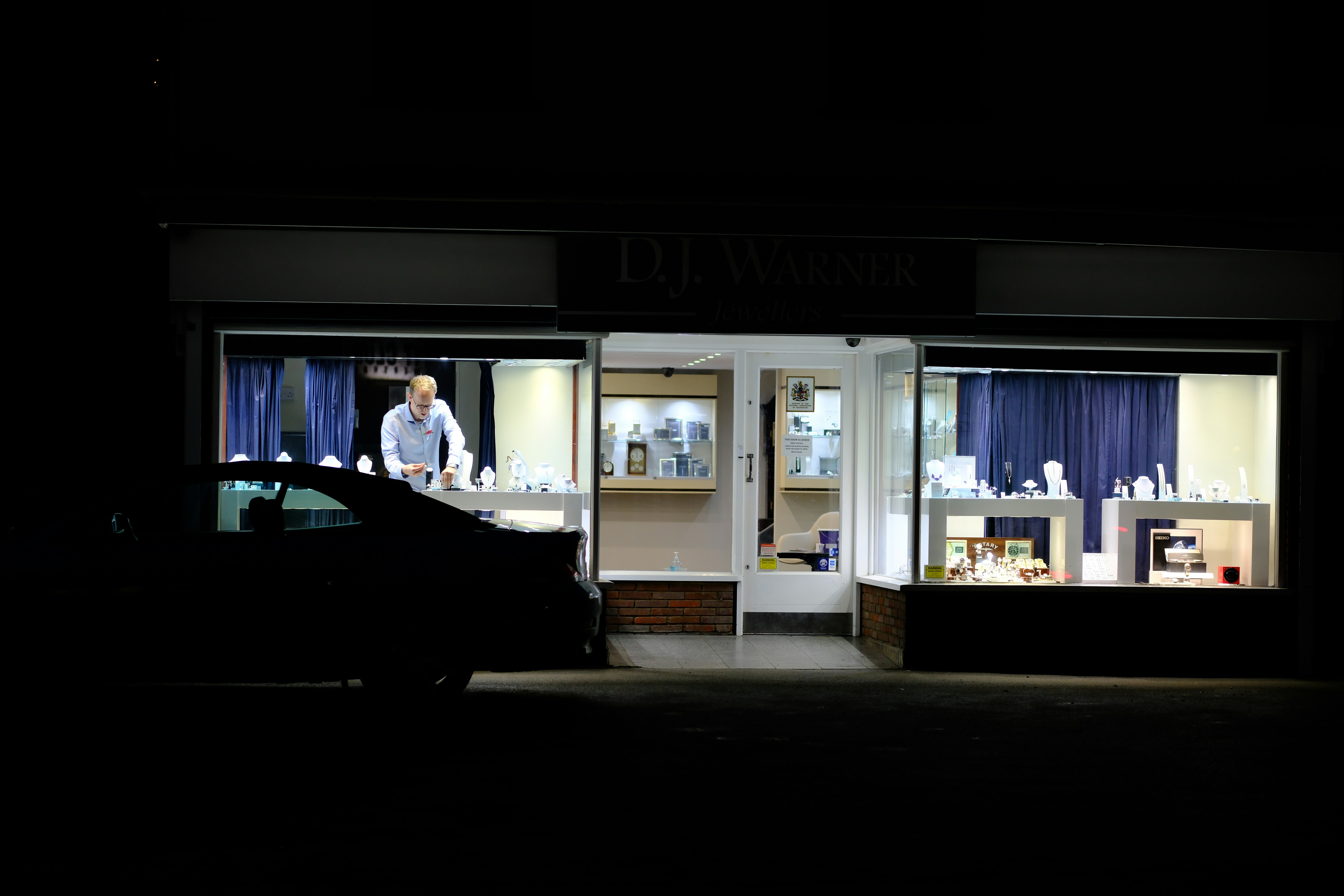 Silent Jewel: Jewelry Store Bathed in Night-Glow Exterior