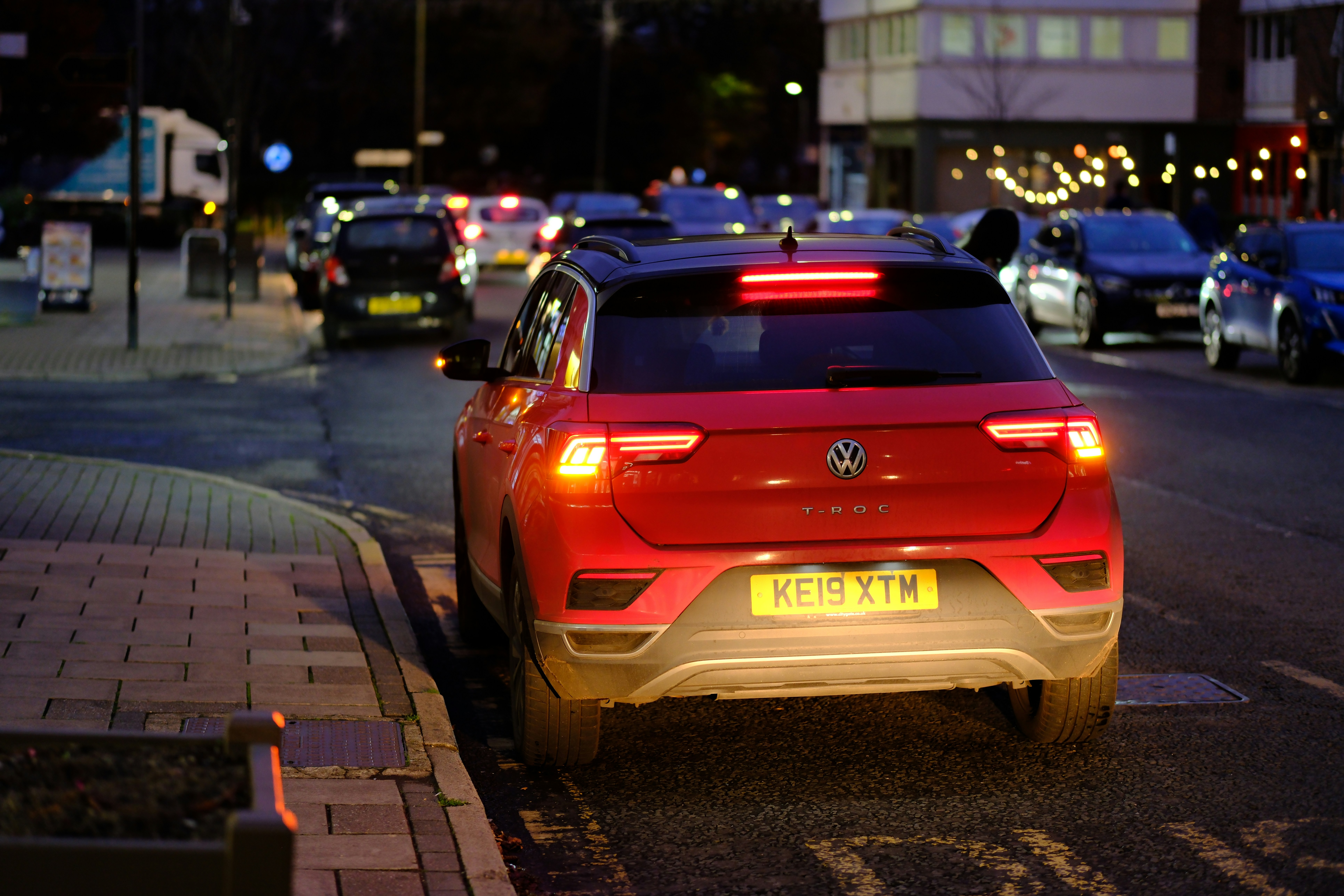 Red VW T-Roc Hooded by Evening Street Lights