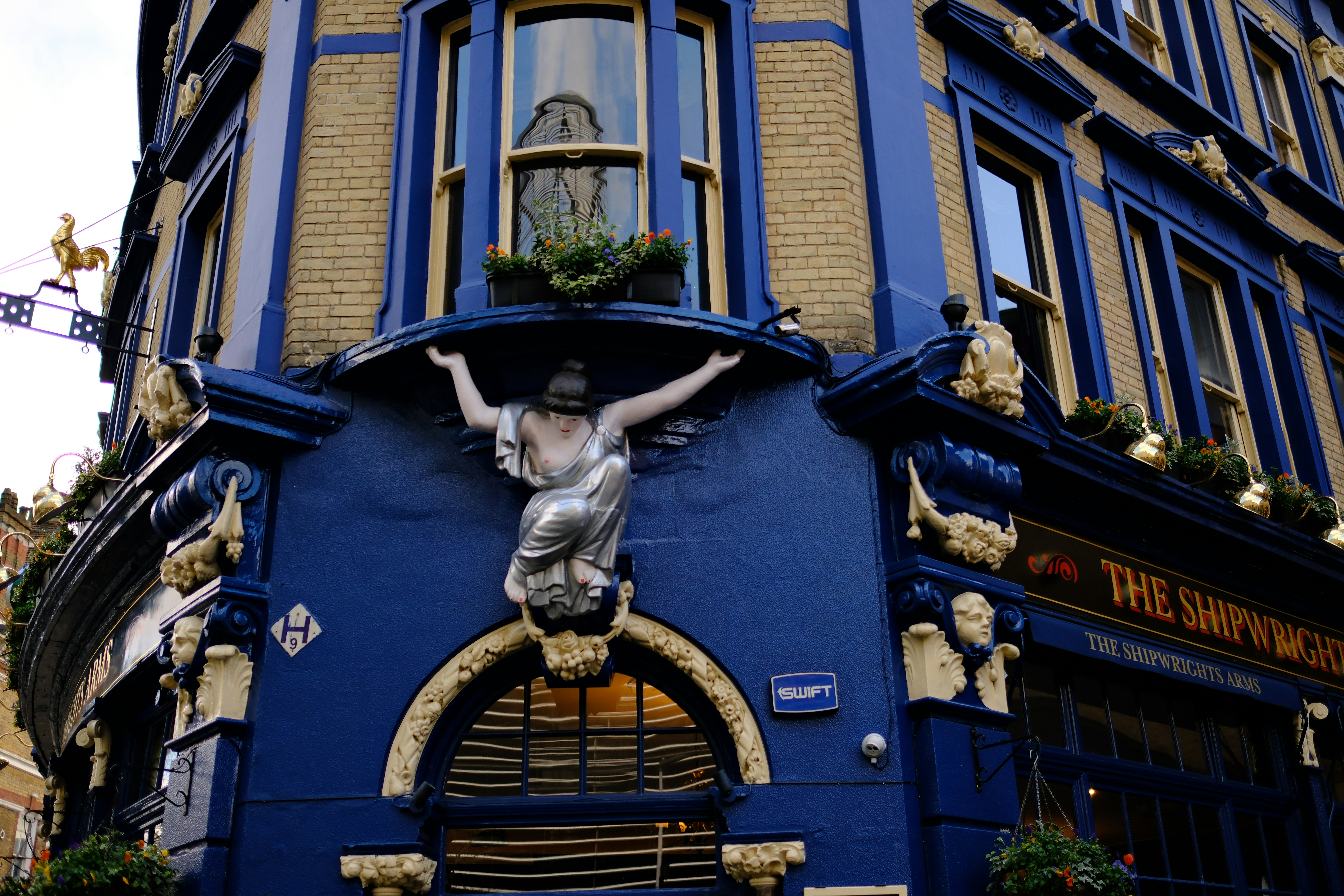 Blue Cornerstone: A Golden Facade and a Crucifixion of Details