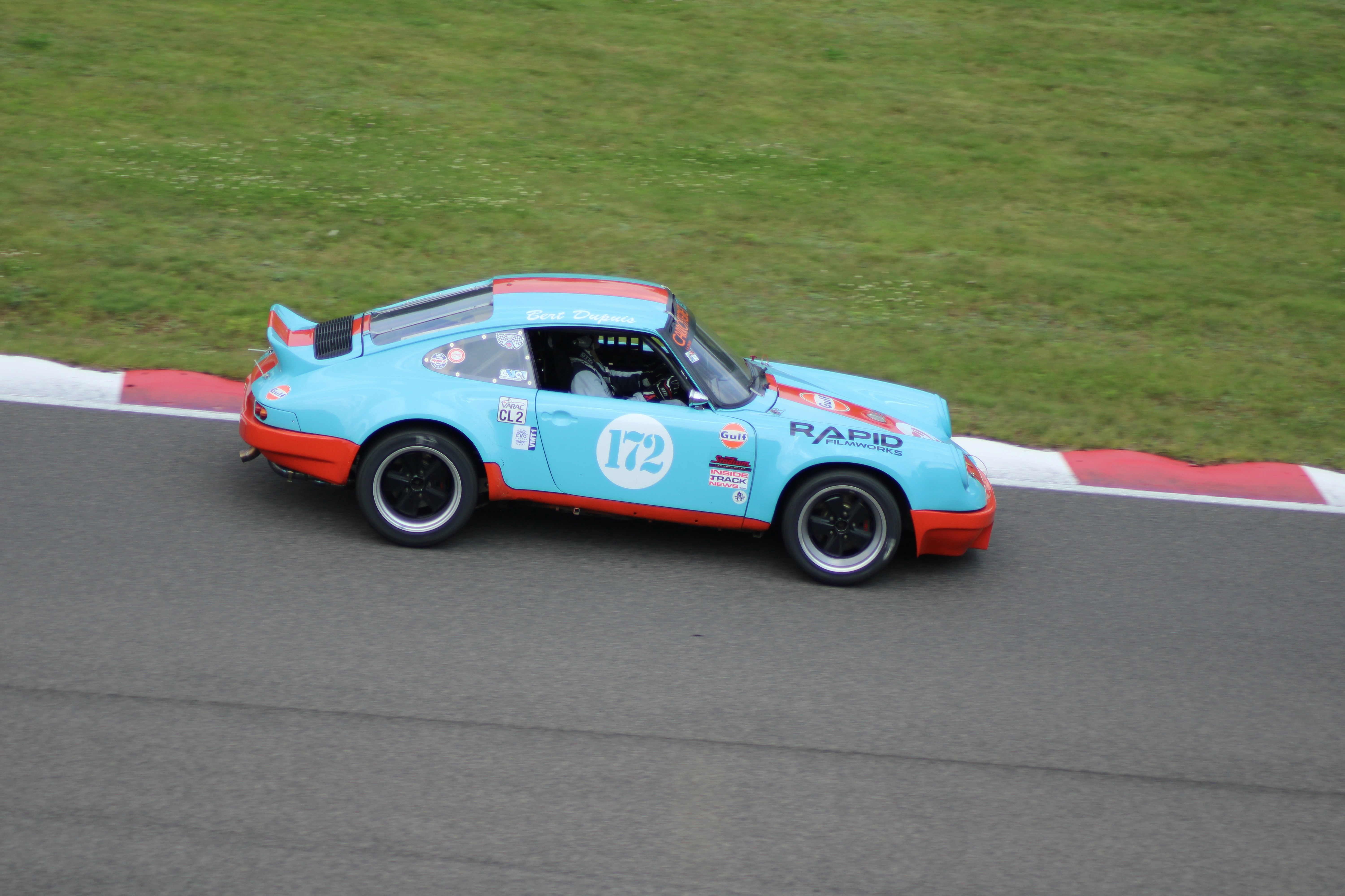 Azure racer on a winding track: vintage coupe in mid‑drift