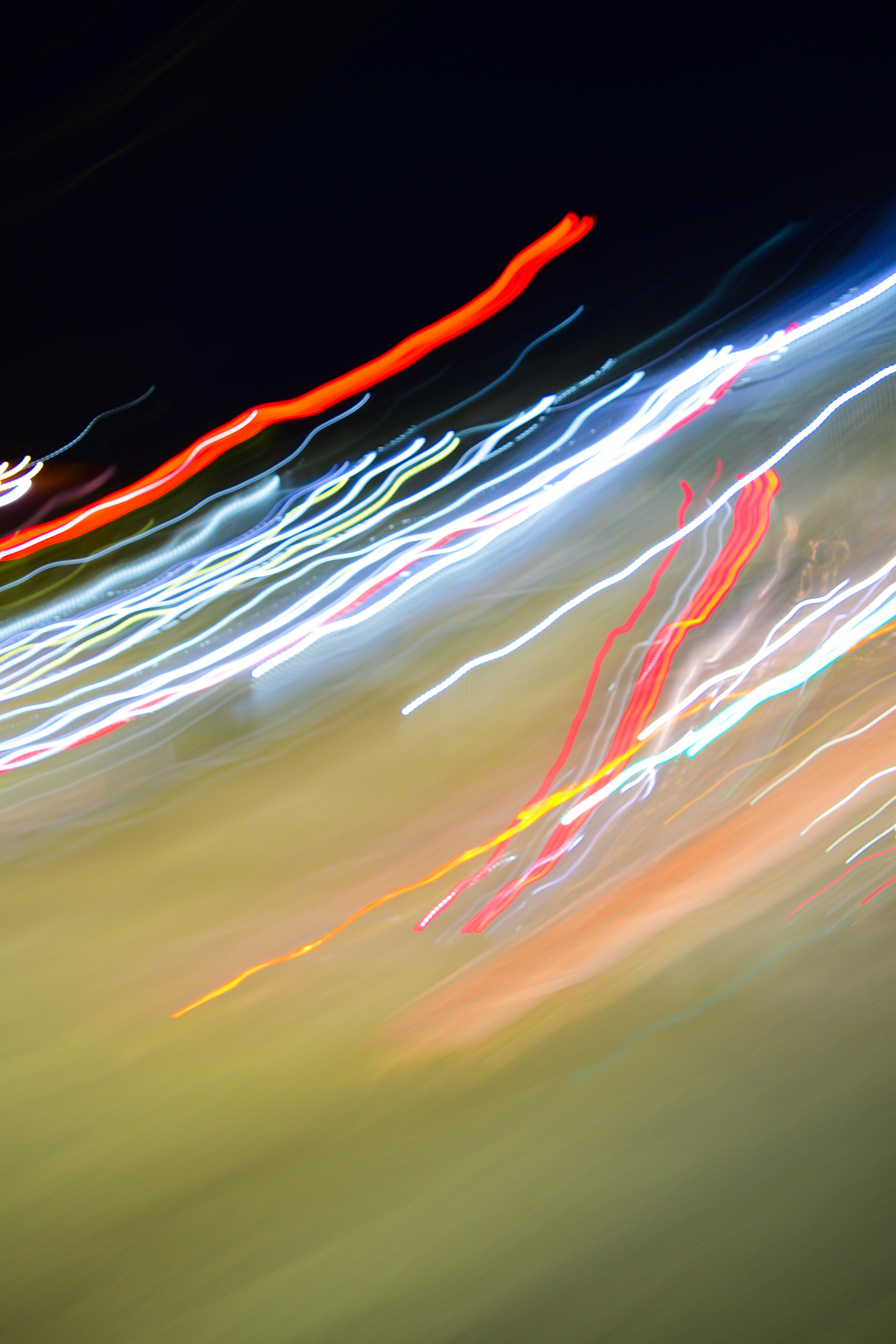 Neon Stream: Night traffic trails in a kinetic blur
