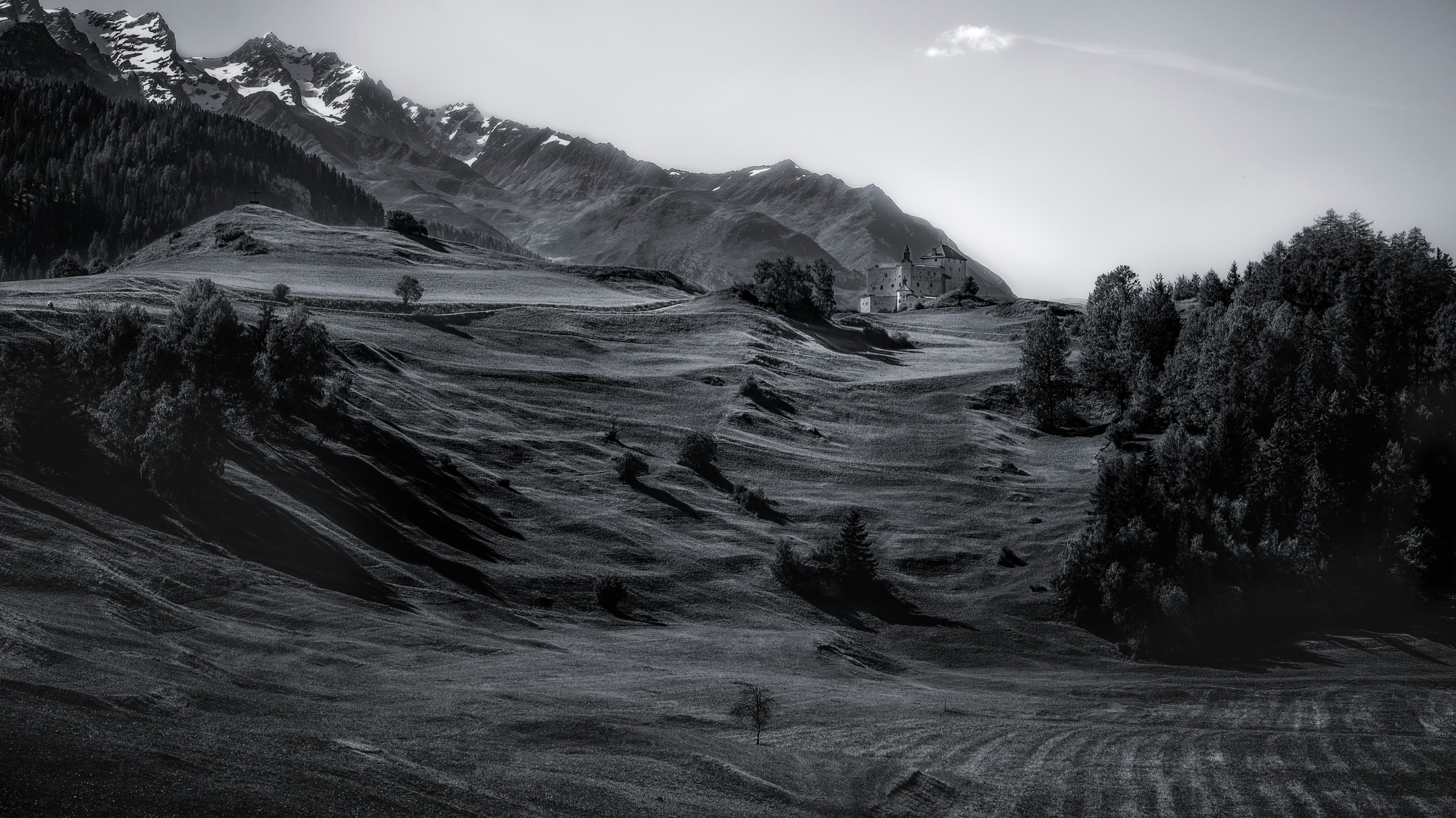 Monolithic Valley: AQuiet Summit under Clouded Sky