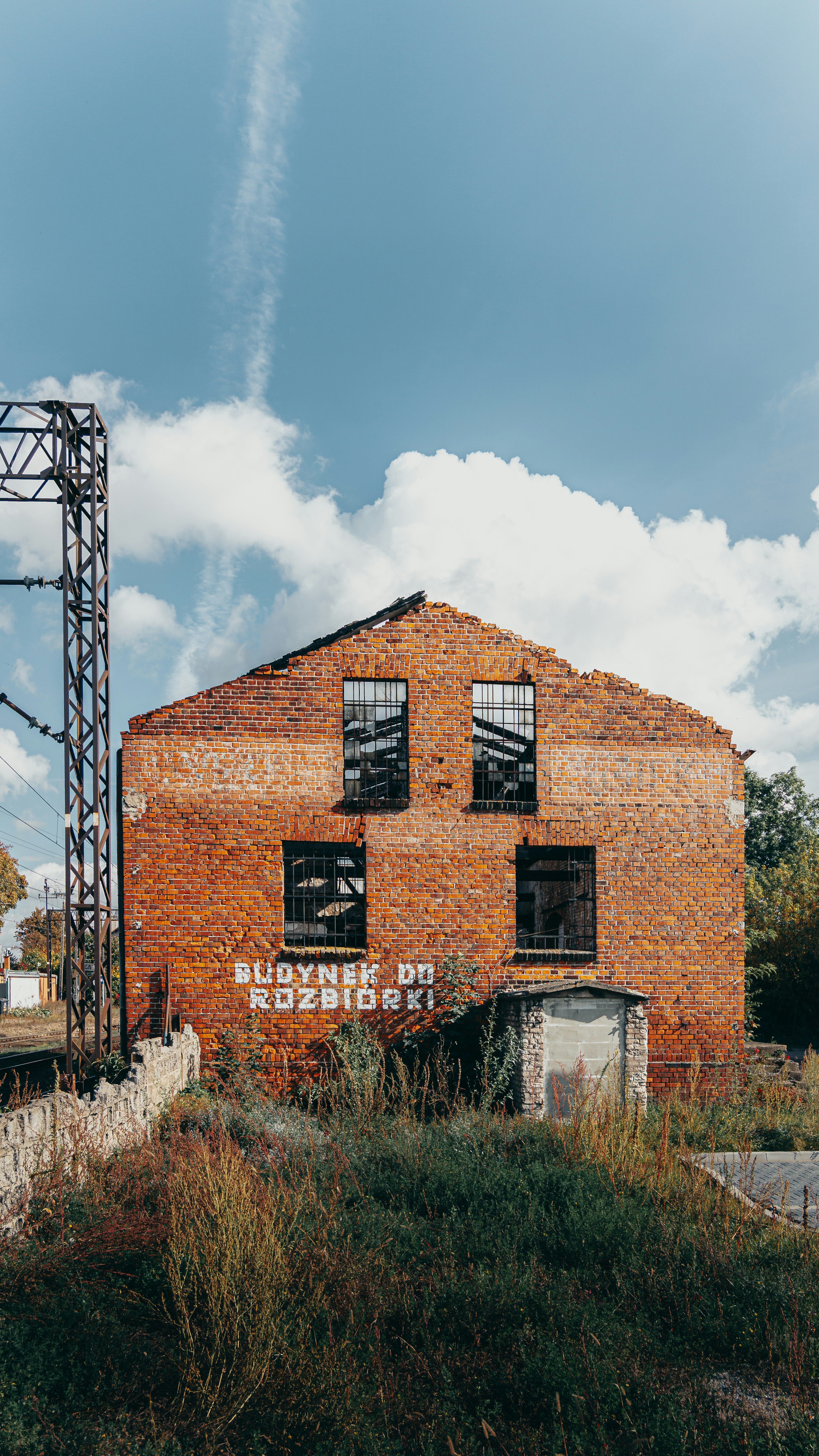Red Brick Relic: The Abandoned Factory Gable Under Wide-Open Sky