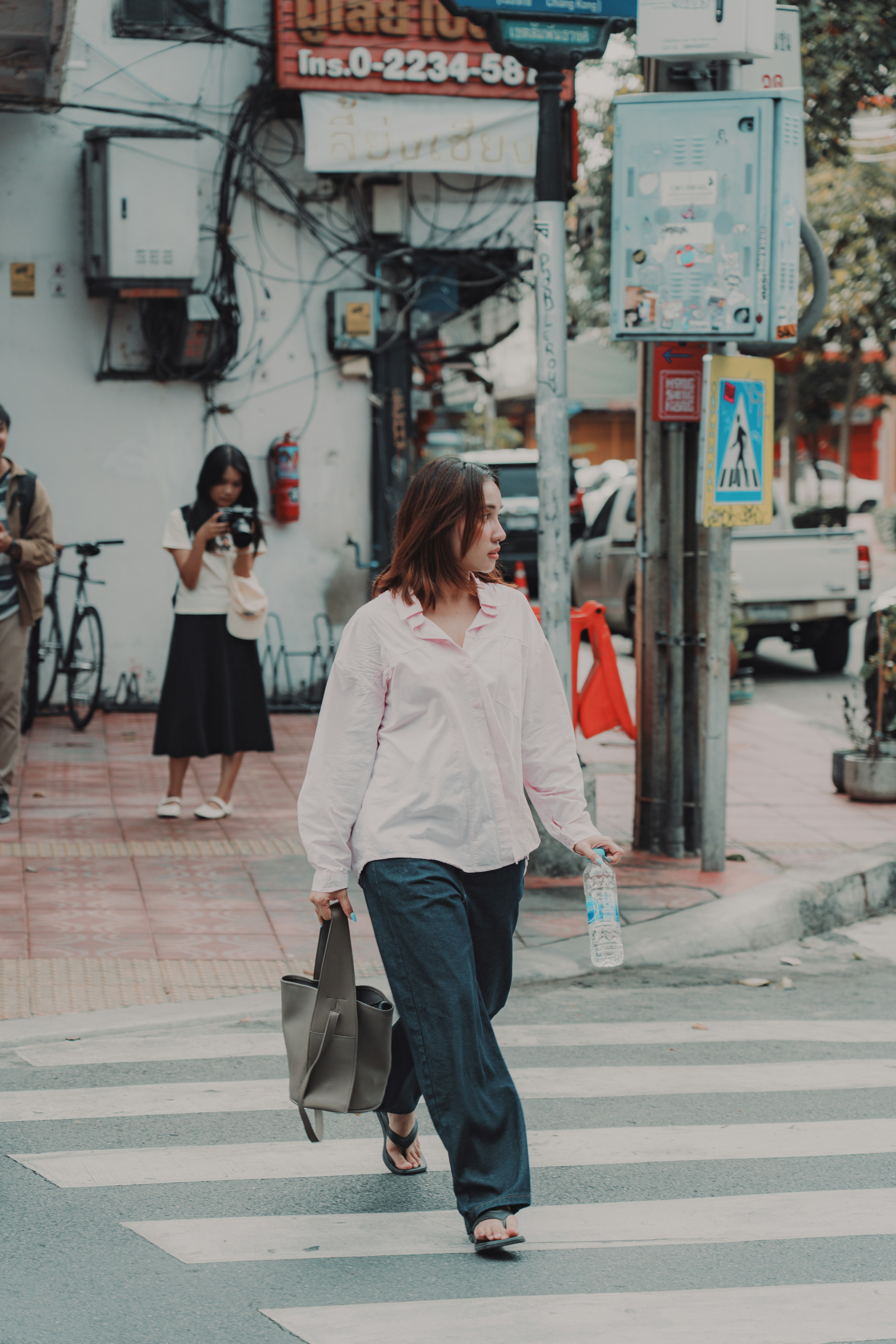 Crosswalk Moment: The Woman in the Pink Shirt Steps into the City Pulse