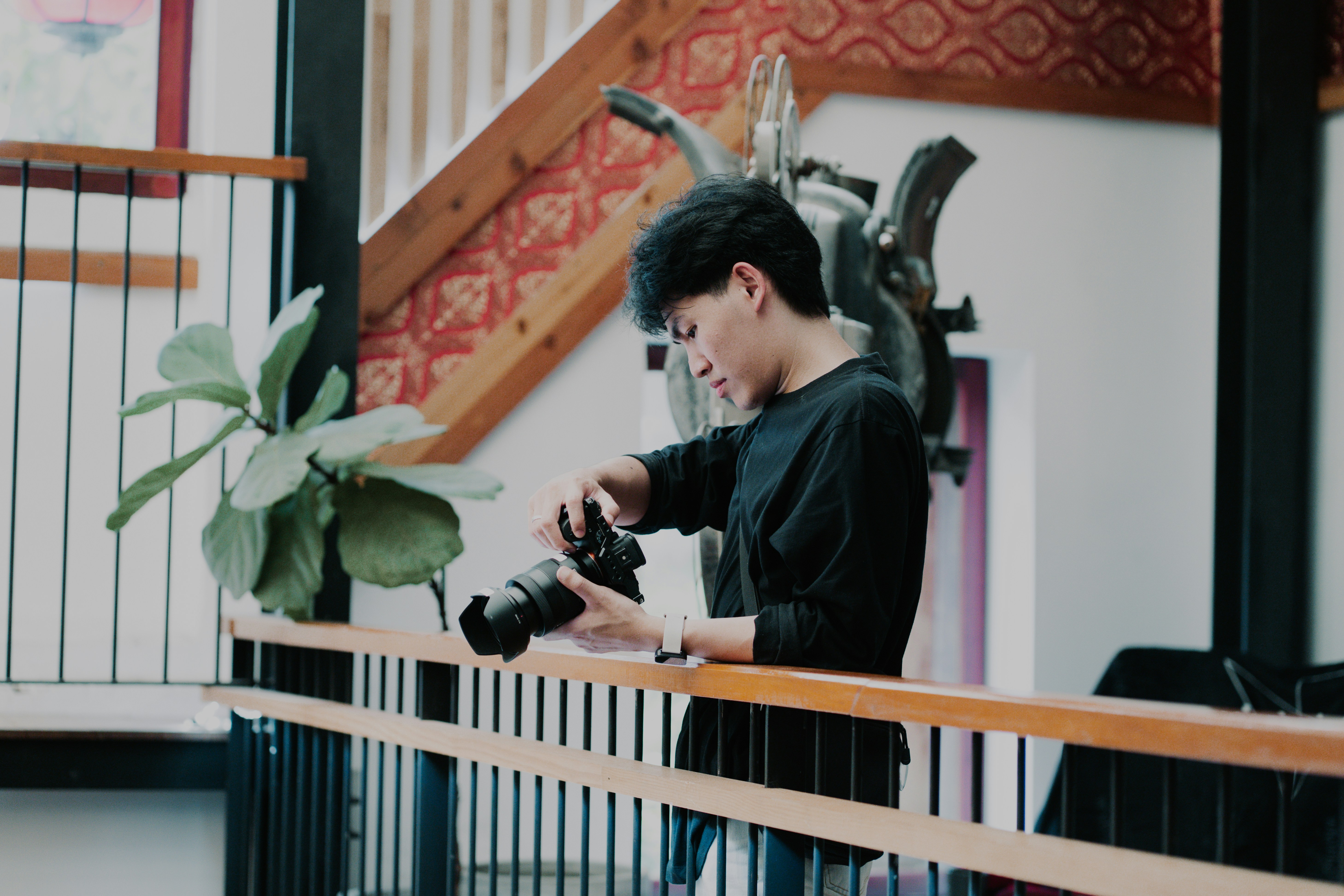 The Quiet Focus: A Photographer at the Rail